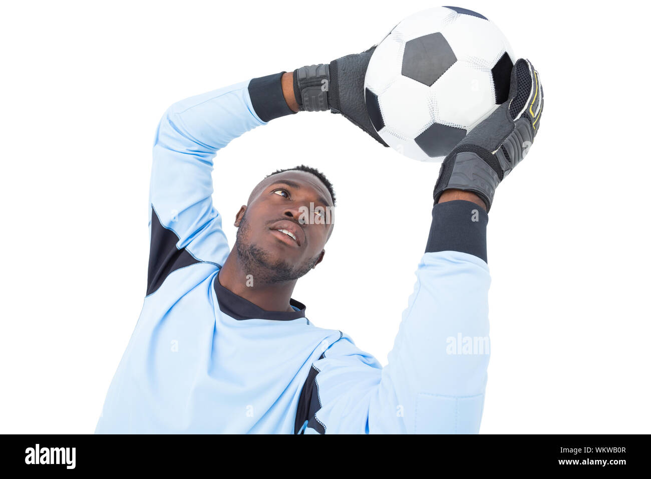 Goalkeeper in blue making a save on white background Stock Photo - Alamy
