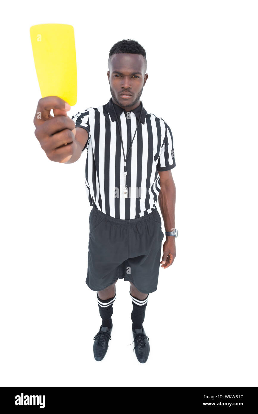 Serious referee showing yellow card on white background Stock Photo - Alamy