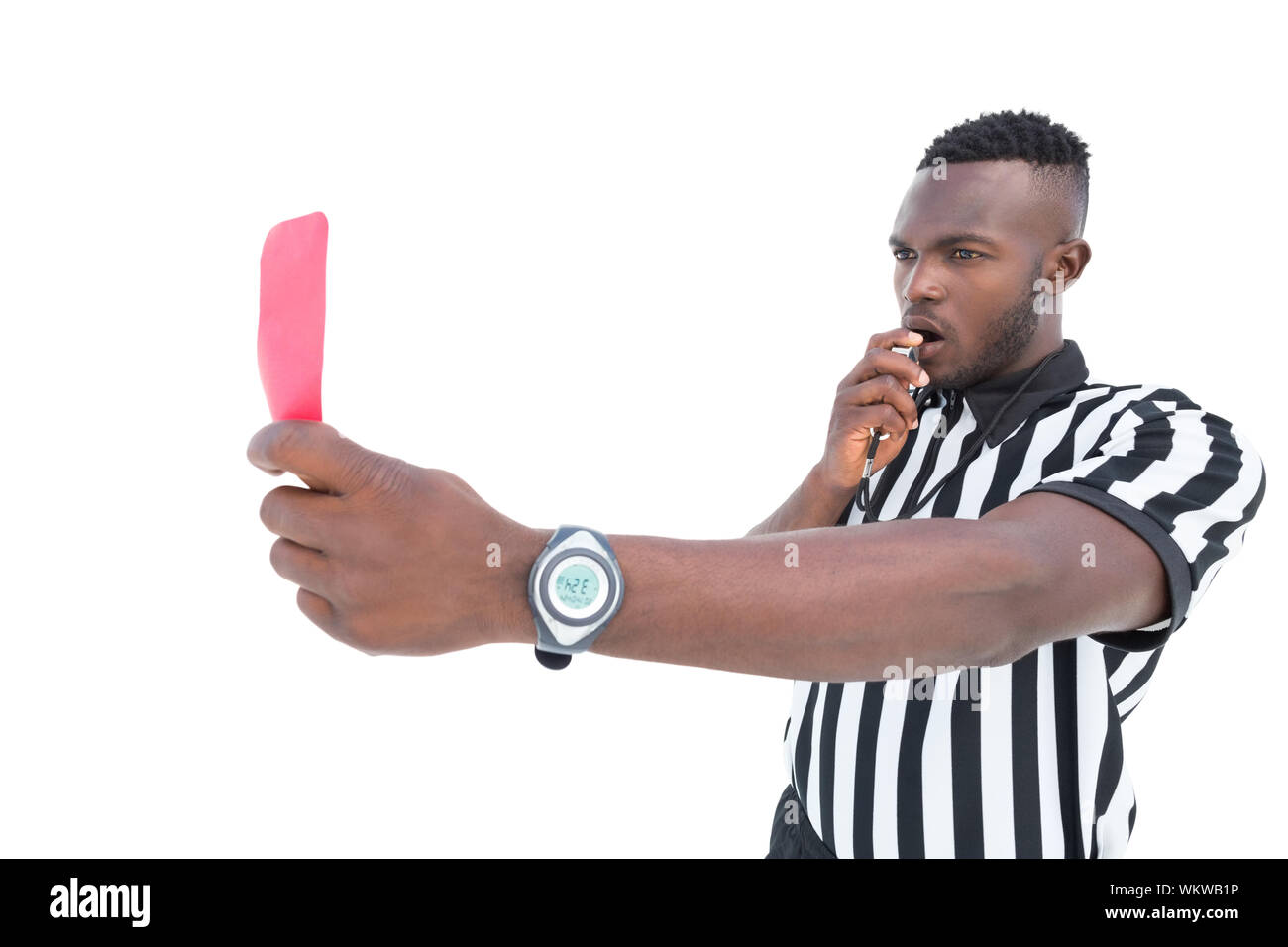 Serious referee showing red card blowing whistle on white background ...
