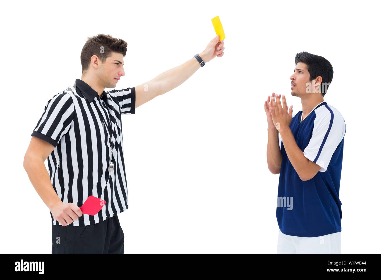 Referee showing yellow card to football player on white background ...