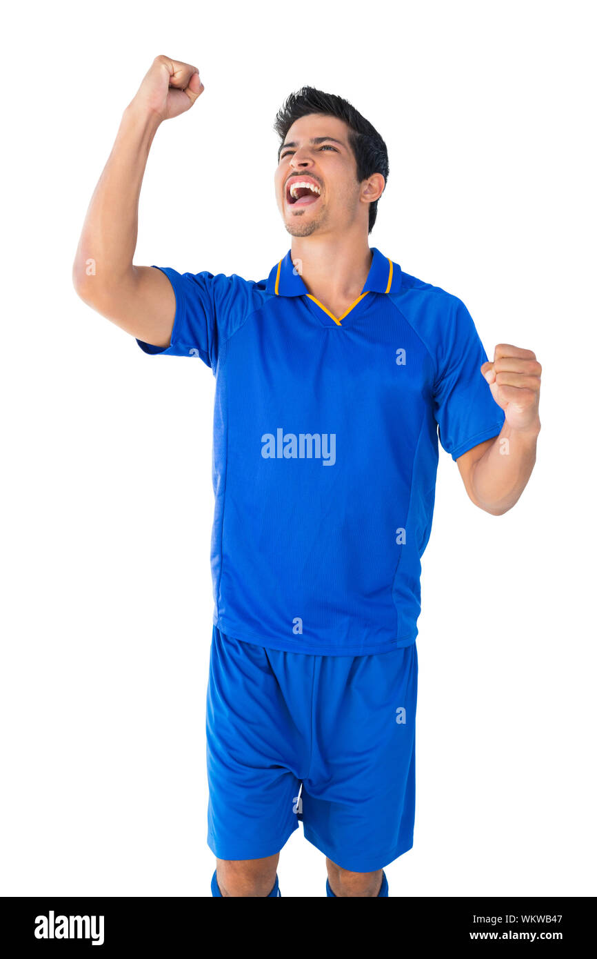 Happy football player in blue celebrating on white background Stock ...