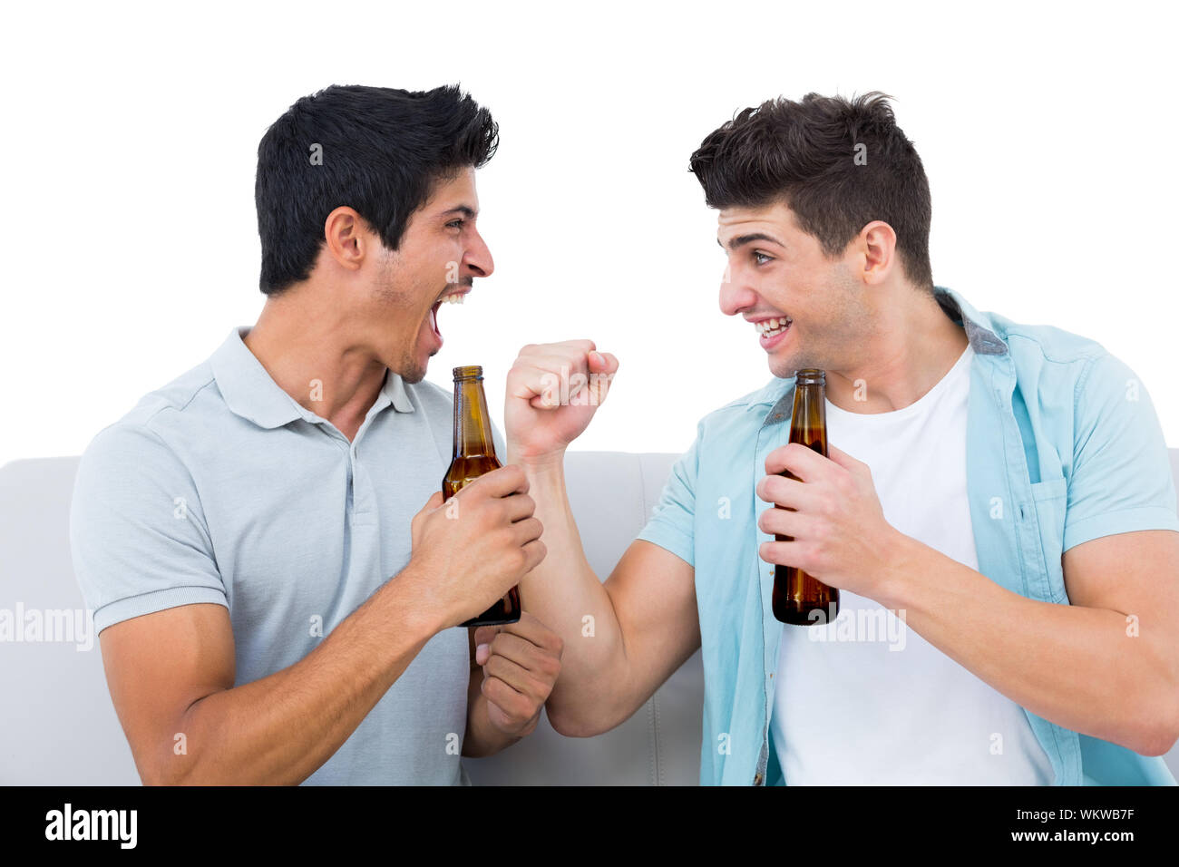 Happy football fans cheering together with beers on white background ...