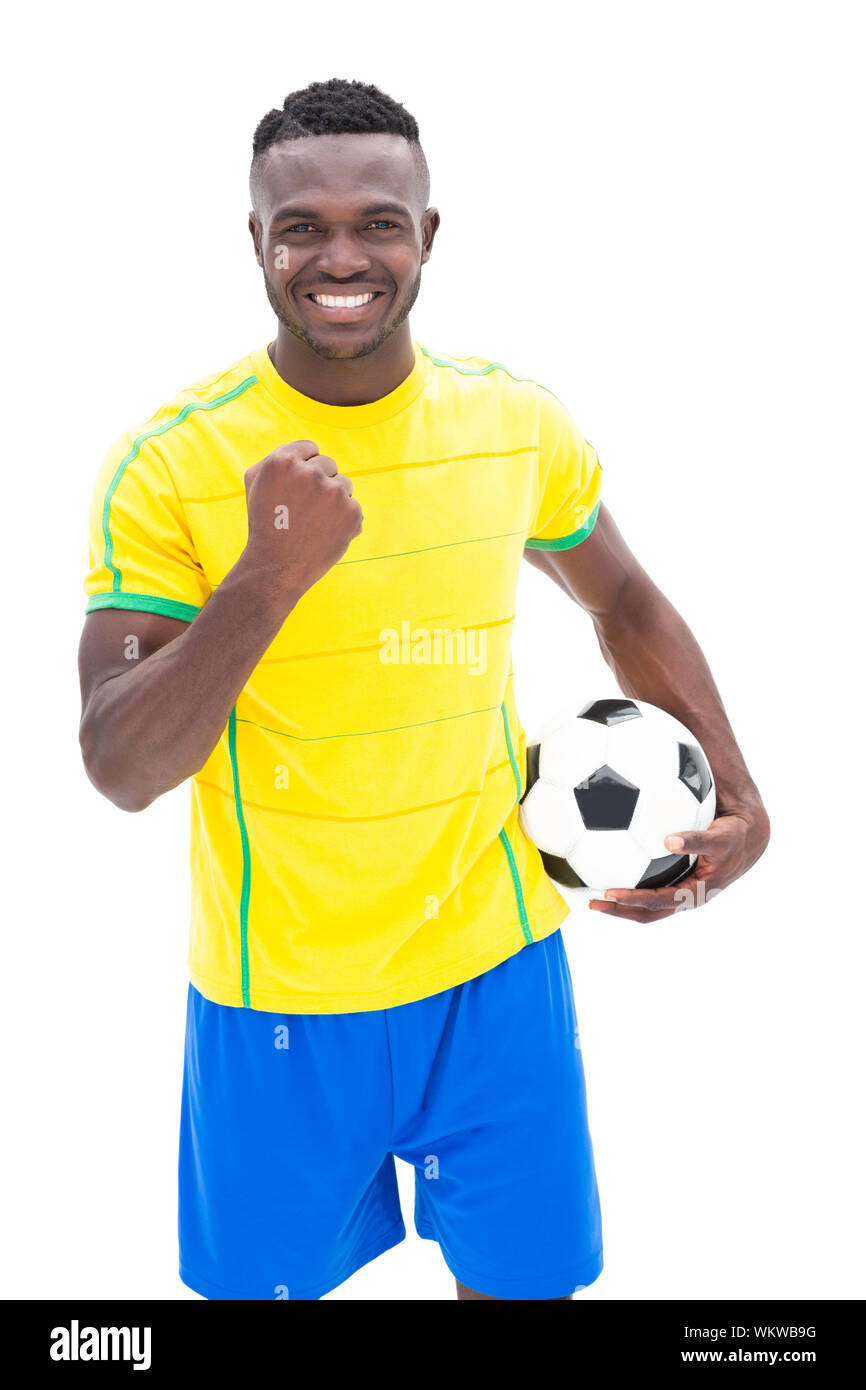 Football player in yellow celebrating a win on white background Stock ...