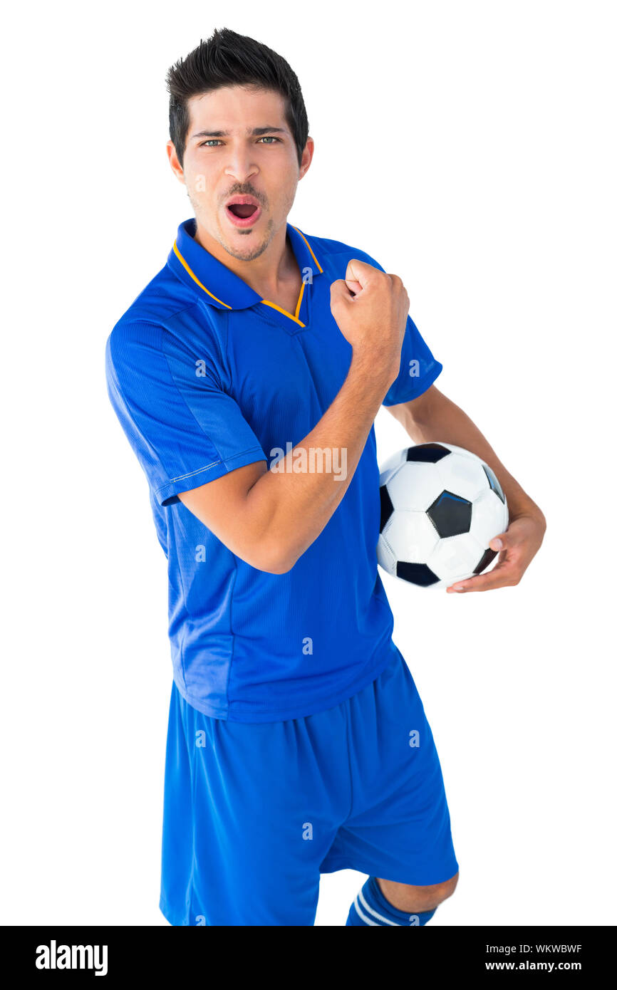 Happy football player in blue celebrating on white background Stock ...