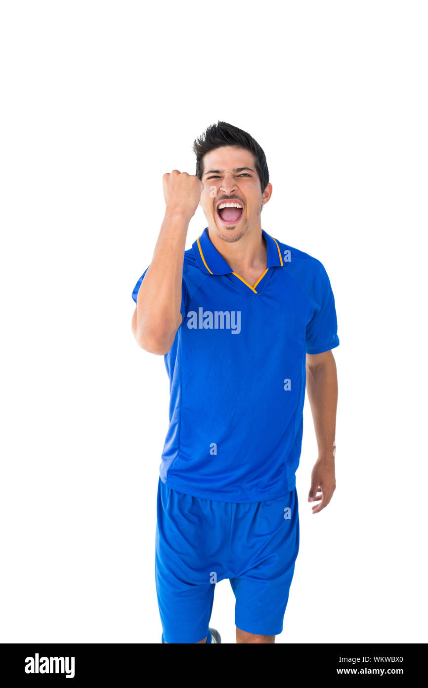 Happy football player in blue celebrating on white background Stock ...