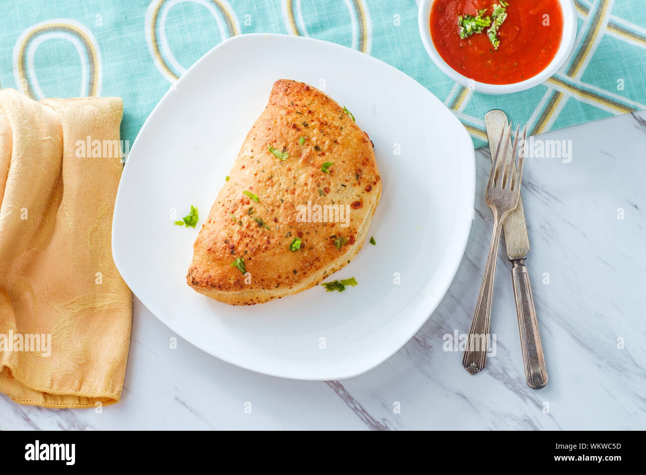 Italian pastry pepperoni and cheese calzone with tomato marinara ...