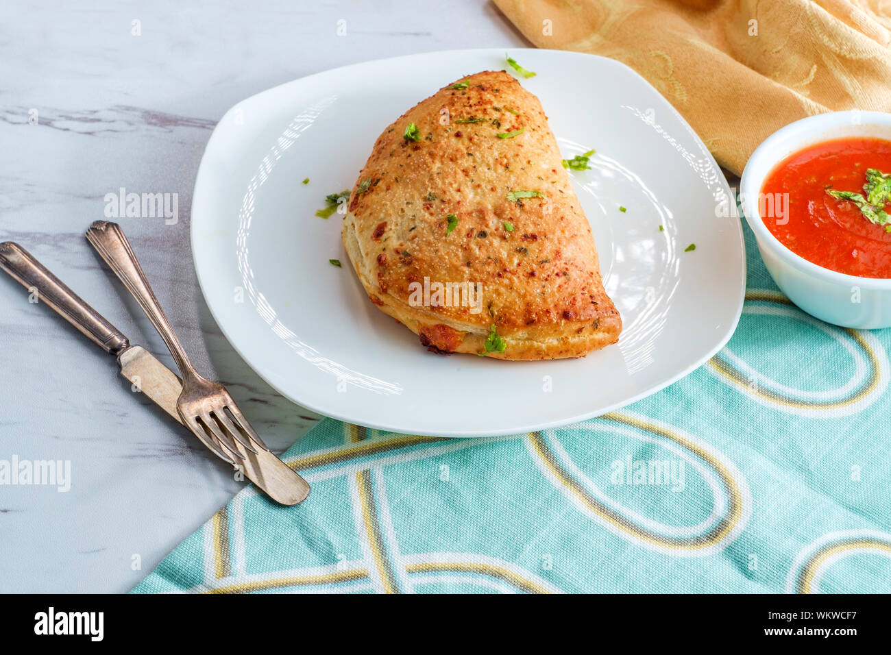 Italian pastry pepperoni and cheese calzone with tomato marinara ...