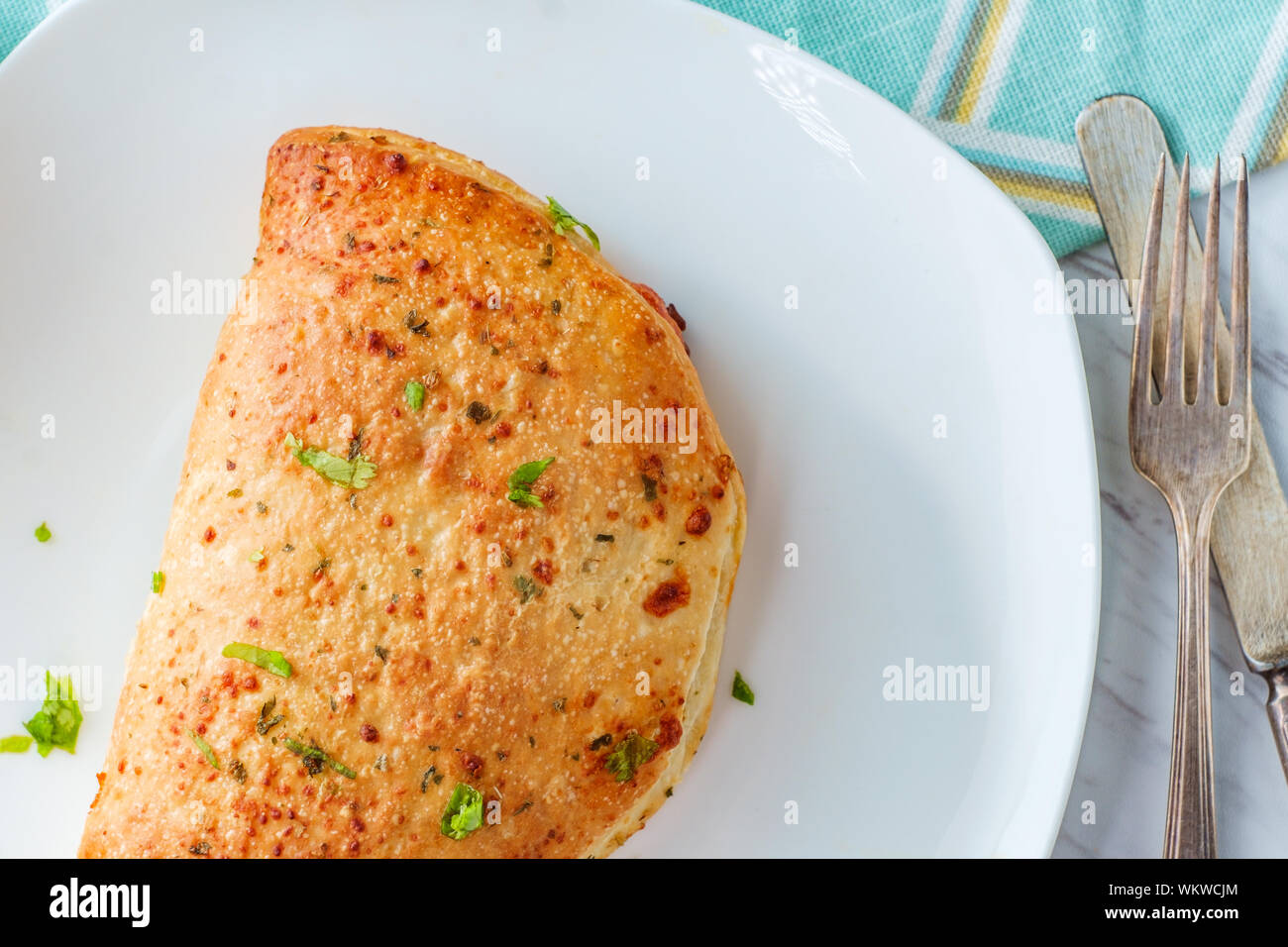 Italian pastry pepperoni and cheese calzone with tomato marinara ...