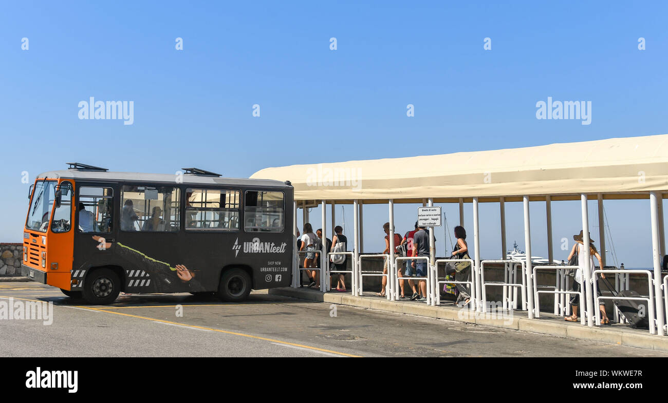 ISLE OF CAPRI, ITALY - AUGUST 2019: People queuing to board a bus at ...