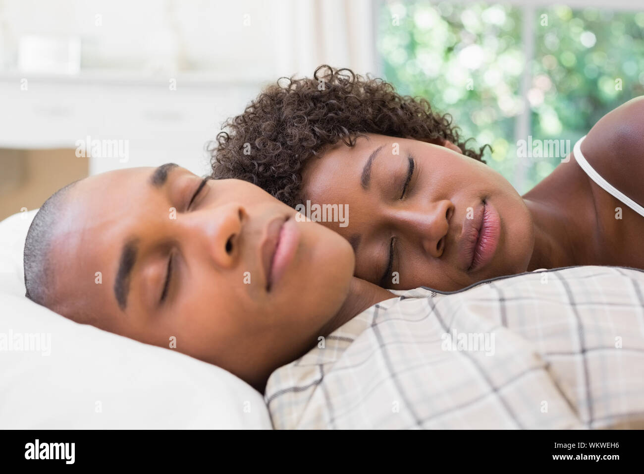 Couple sleeping in bed feelings hi-res stock photography and images - Alamy
