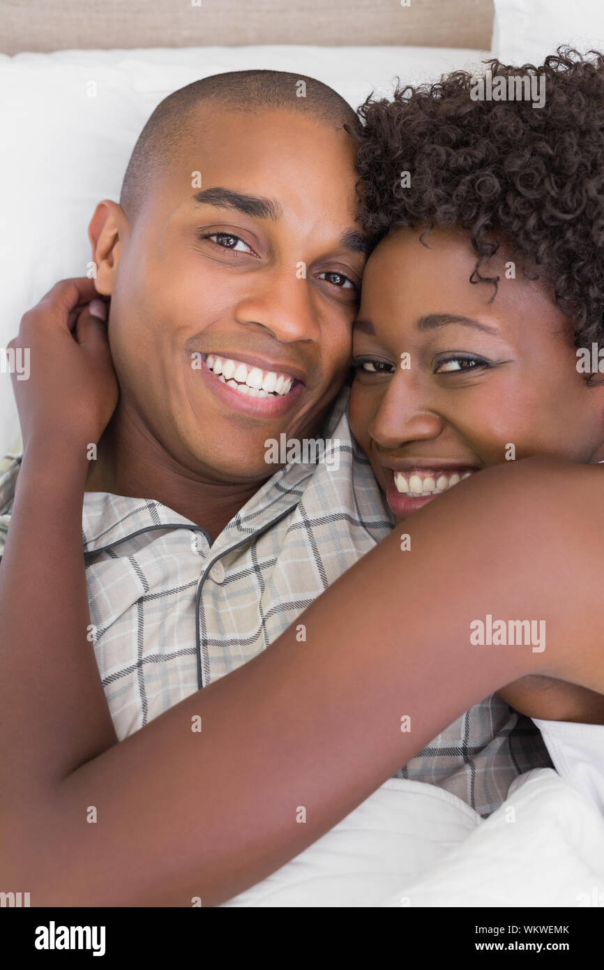 Portrait romantic couple cuddling lying hi-res stock photography and ...