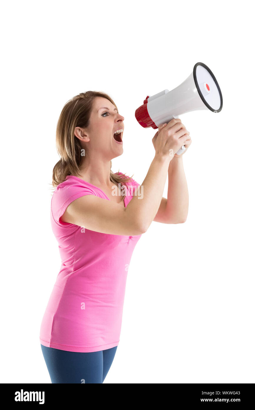 Young woman shouting into bullhorn over white background Stock Photo ...