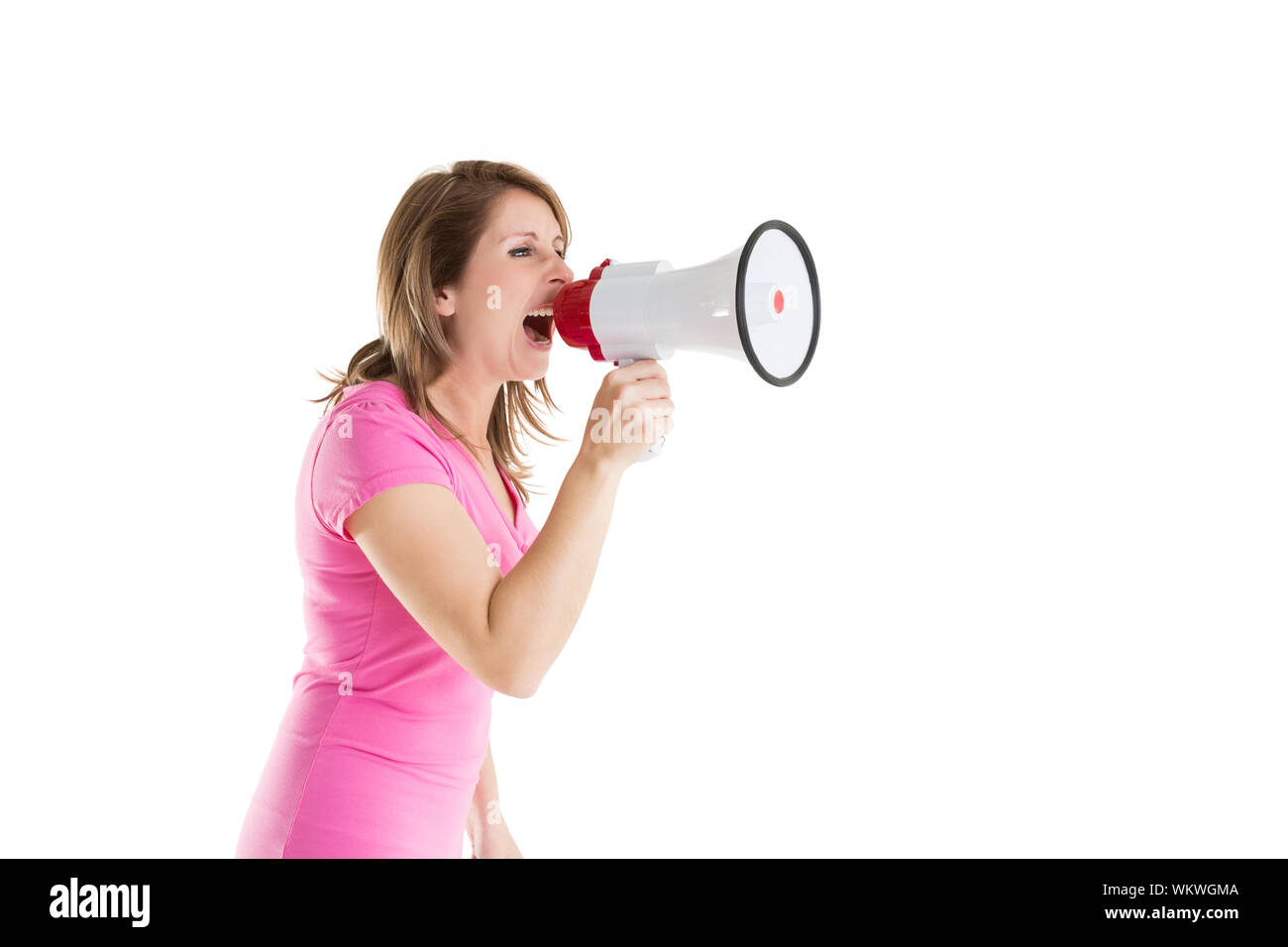 Side view of woman shouting into bullhorn over white background Stock ...