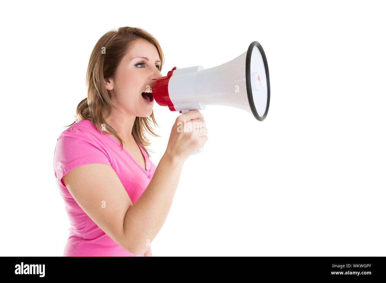 Side view of woman shouting into bullhorn over white background Stock ...