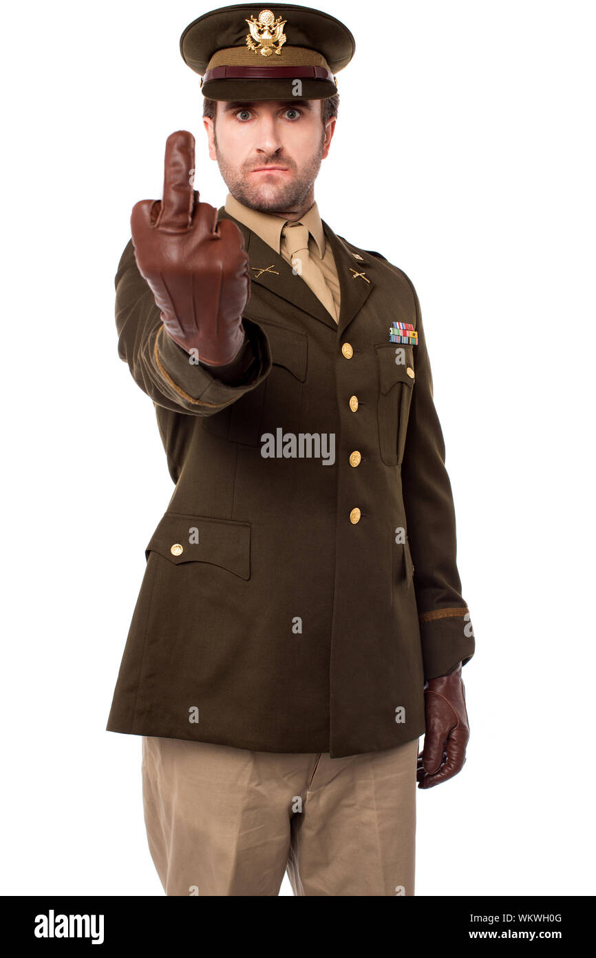 Evil gesture by angry young military man Stock Photo - Alamy