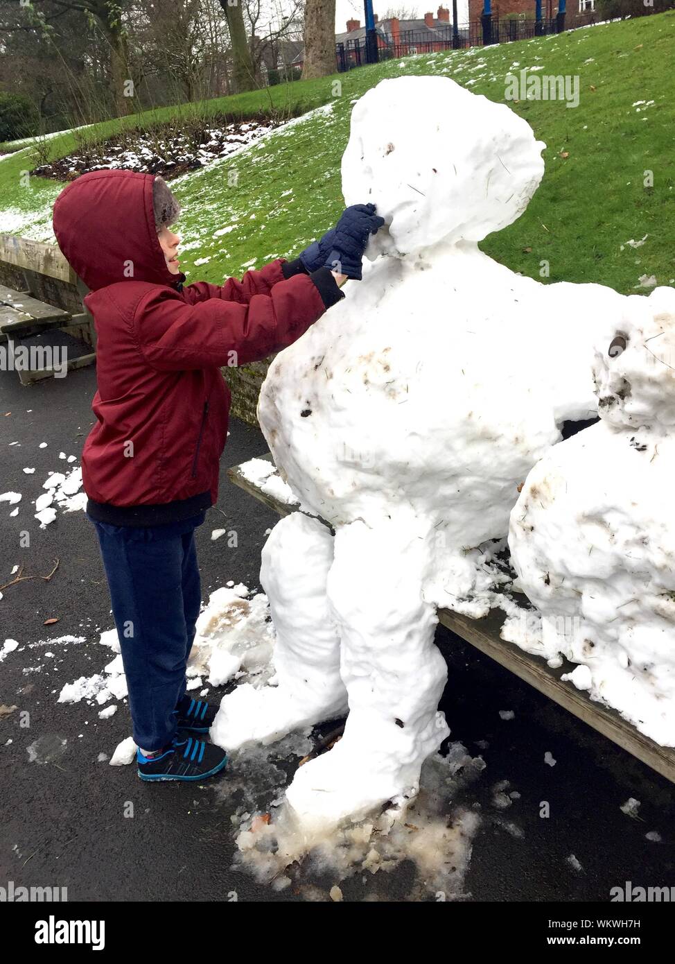 Boy and a snowman hi-res stock photography and images - Alamy