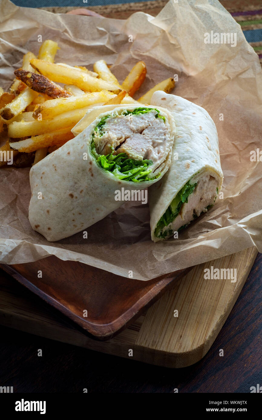 Chicken Caesar salad wrap sandwich with romaine lettuce and french ...