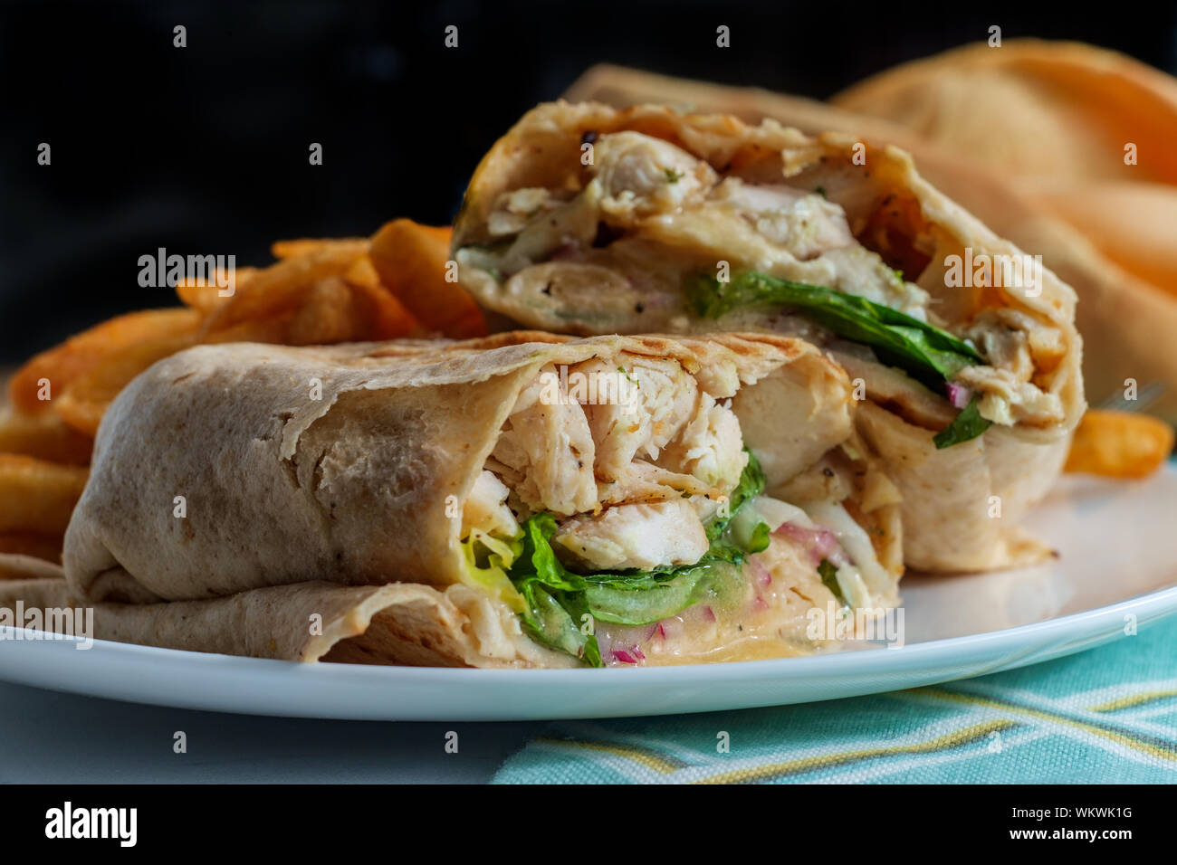 Chicken Caesar salad wrap sandwich with romaine lettuce and french ...