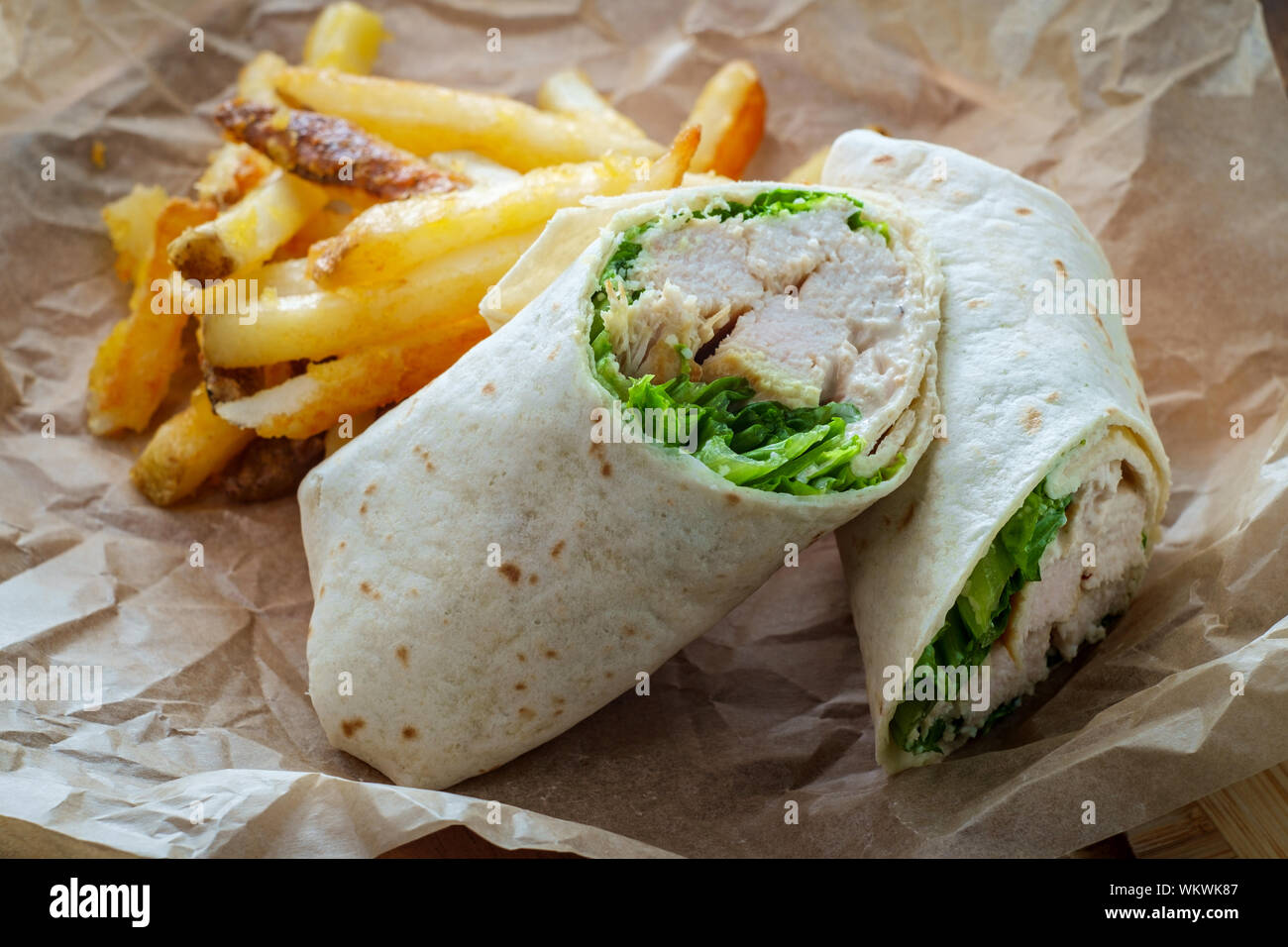 Chicken Caesar salad wrap sandwich with romaine lettuce and french ...