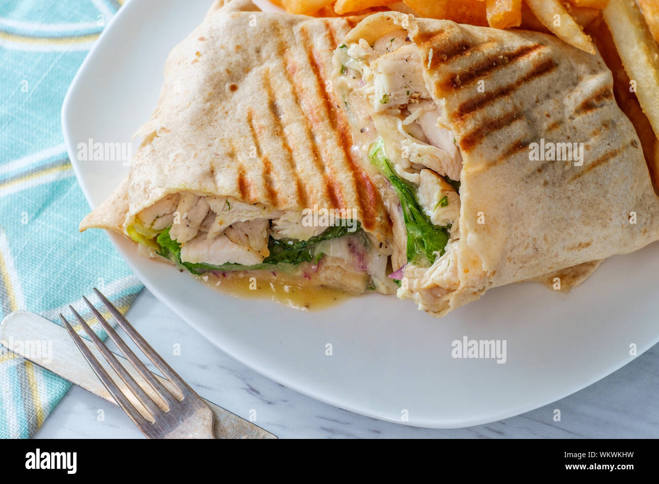 Chicken Caesar salad wrap sandwich with romaine lettuce and french ...