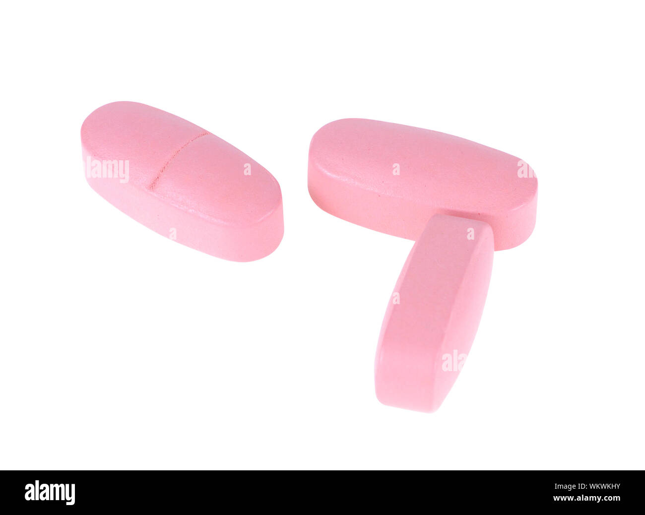 The pink tablets isolated on white background Stock Photo - Alamy