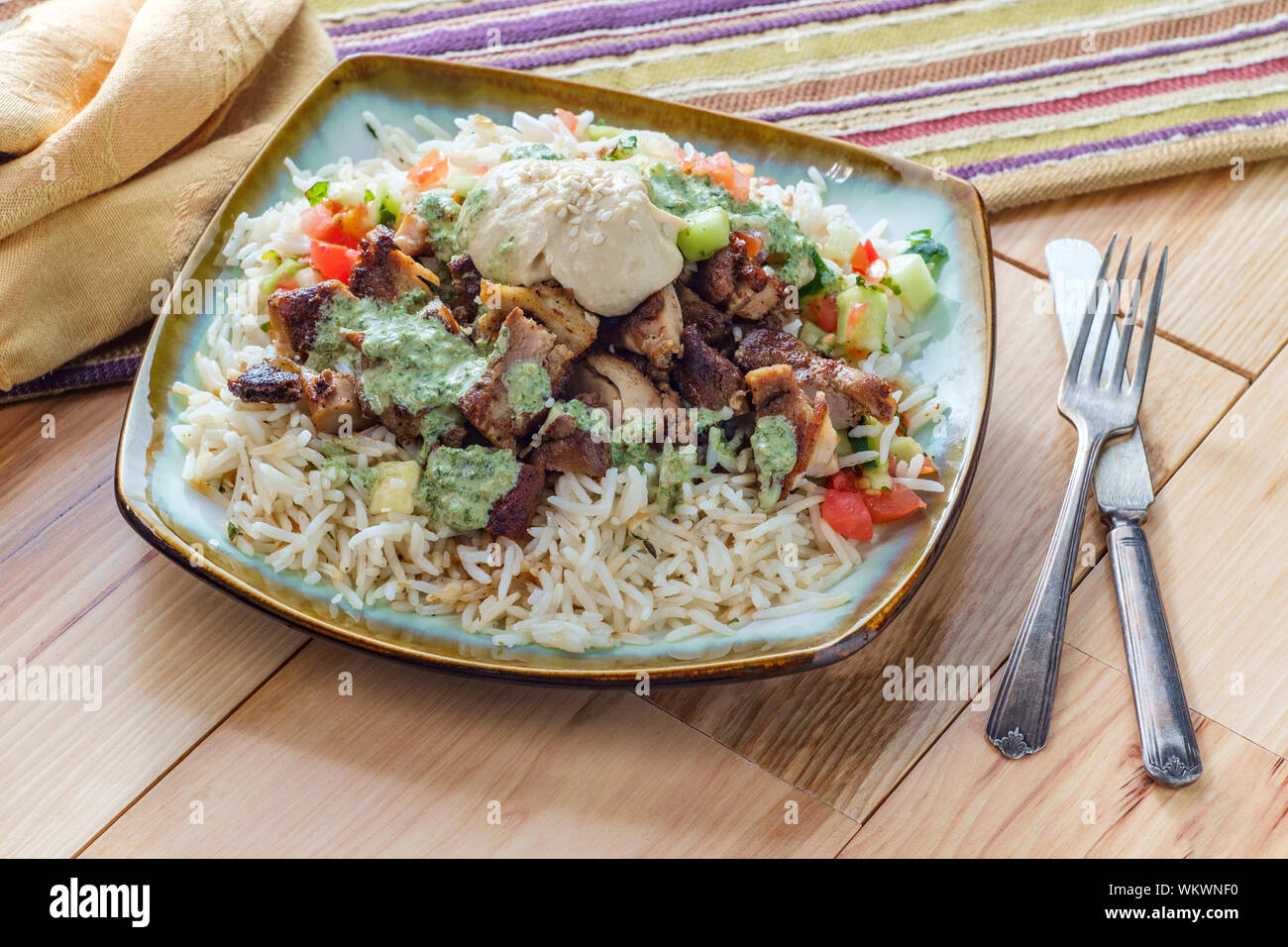 Authentic Middle Eastern chicken Shawarma rice platter with hummus and ...