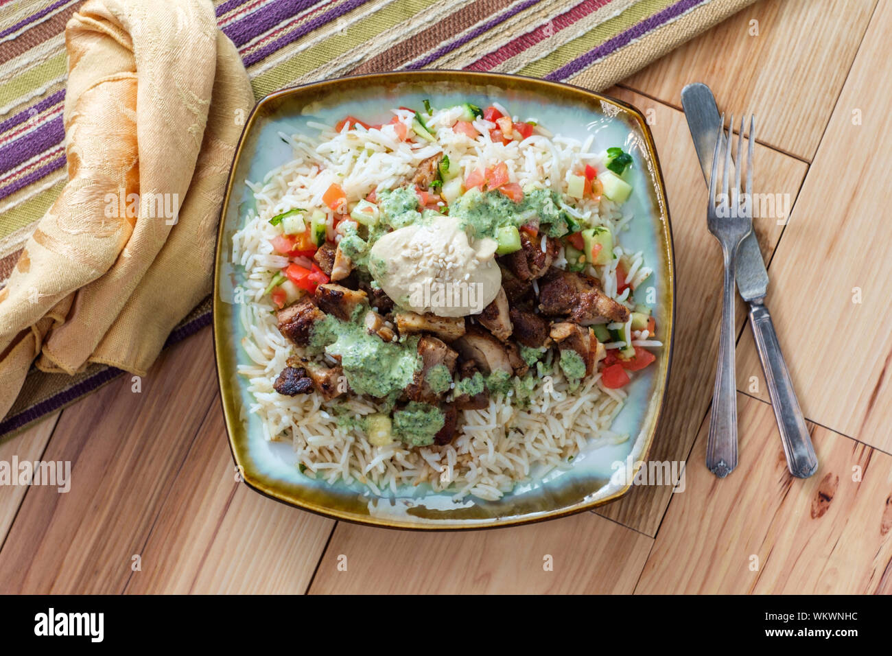 Authentic Middle Eastern chicken Shawarma rice platter with hummus and ...