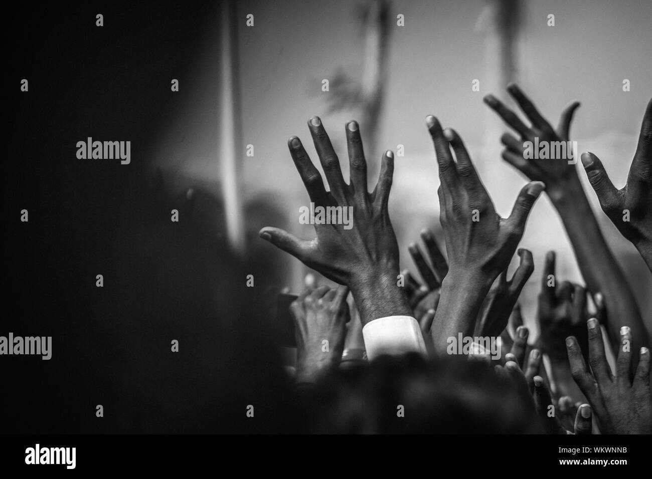 Hands raised crowd Black and White Stock Photos & Images - Alamy