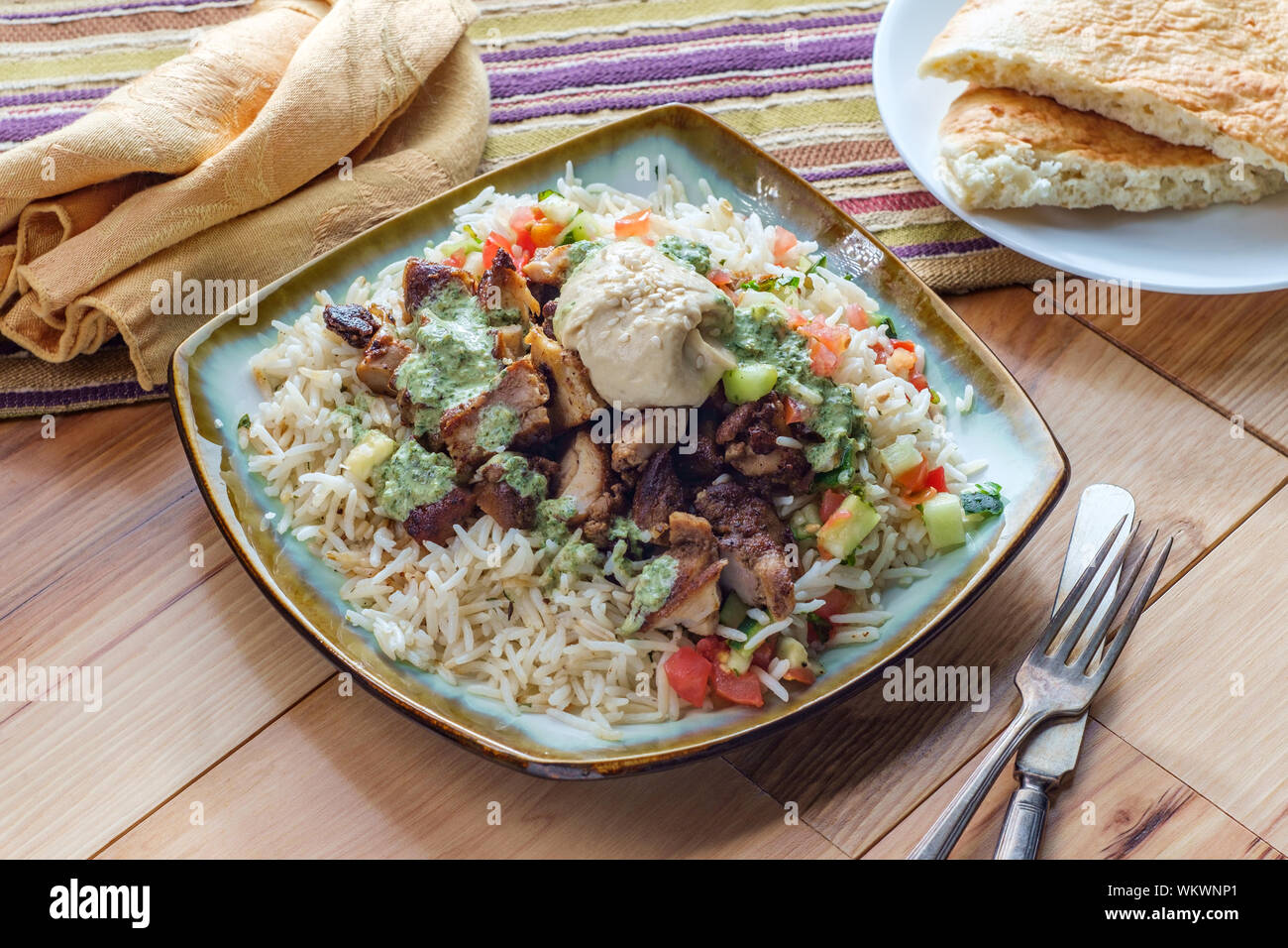 Authentic Middle Eastern chicken Shawarma rice platter with hummus and ...