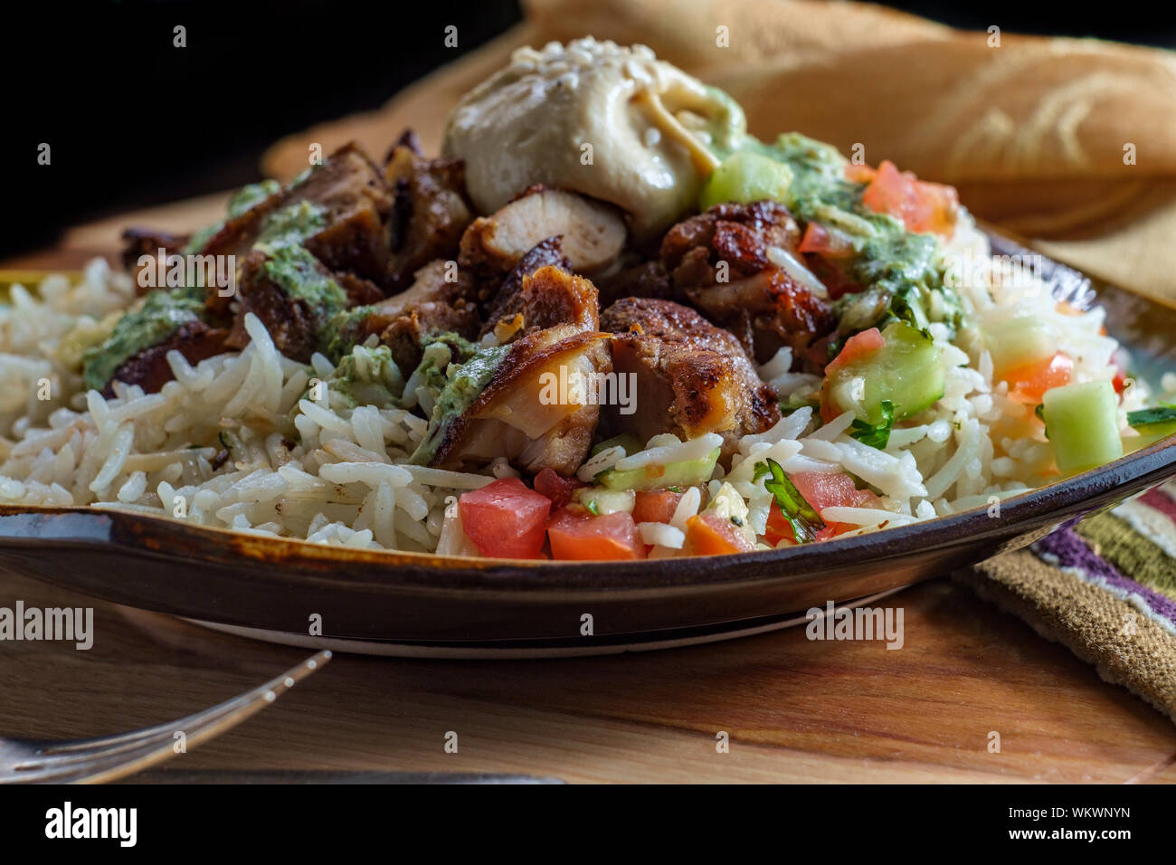 Authentic Middle Eastern chicken Shawarma rice platter with hummus and ...