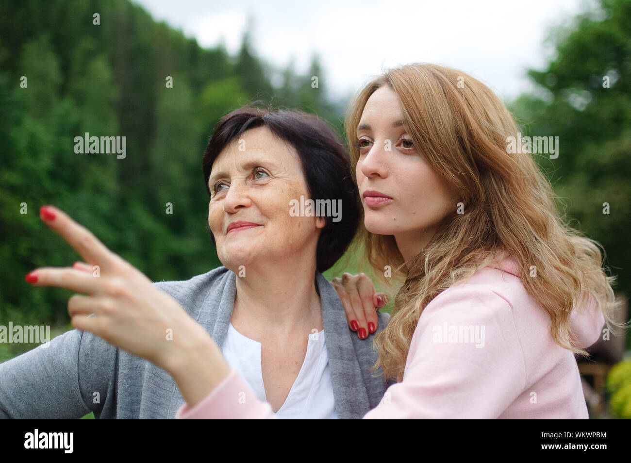Happy senior woman with short dark hair and wrinkles on her face ...