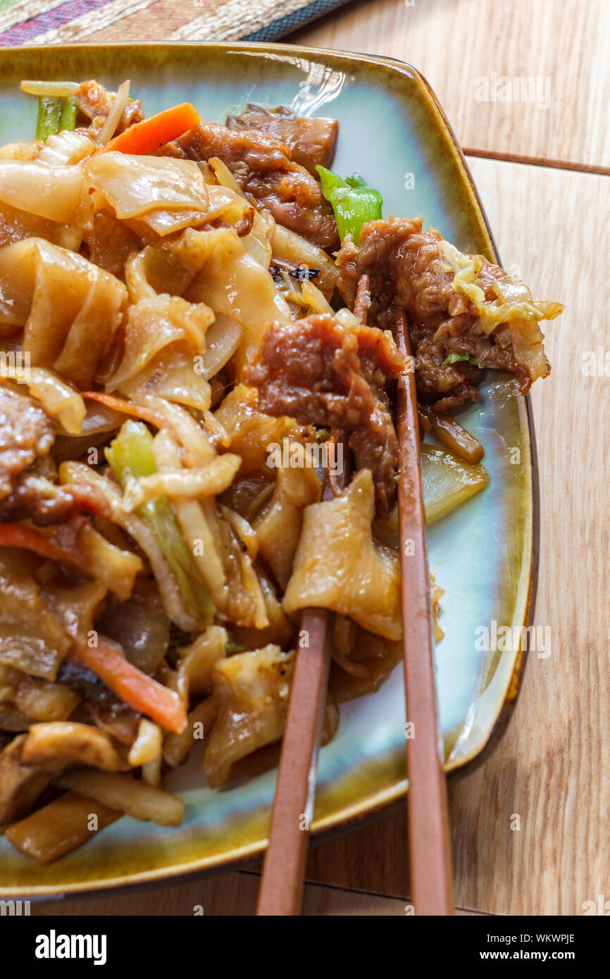 Stir fried Chinese beef chow fun with hor fun wide rice noodles cabbage ...