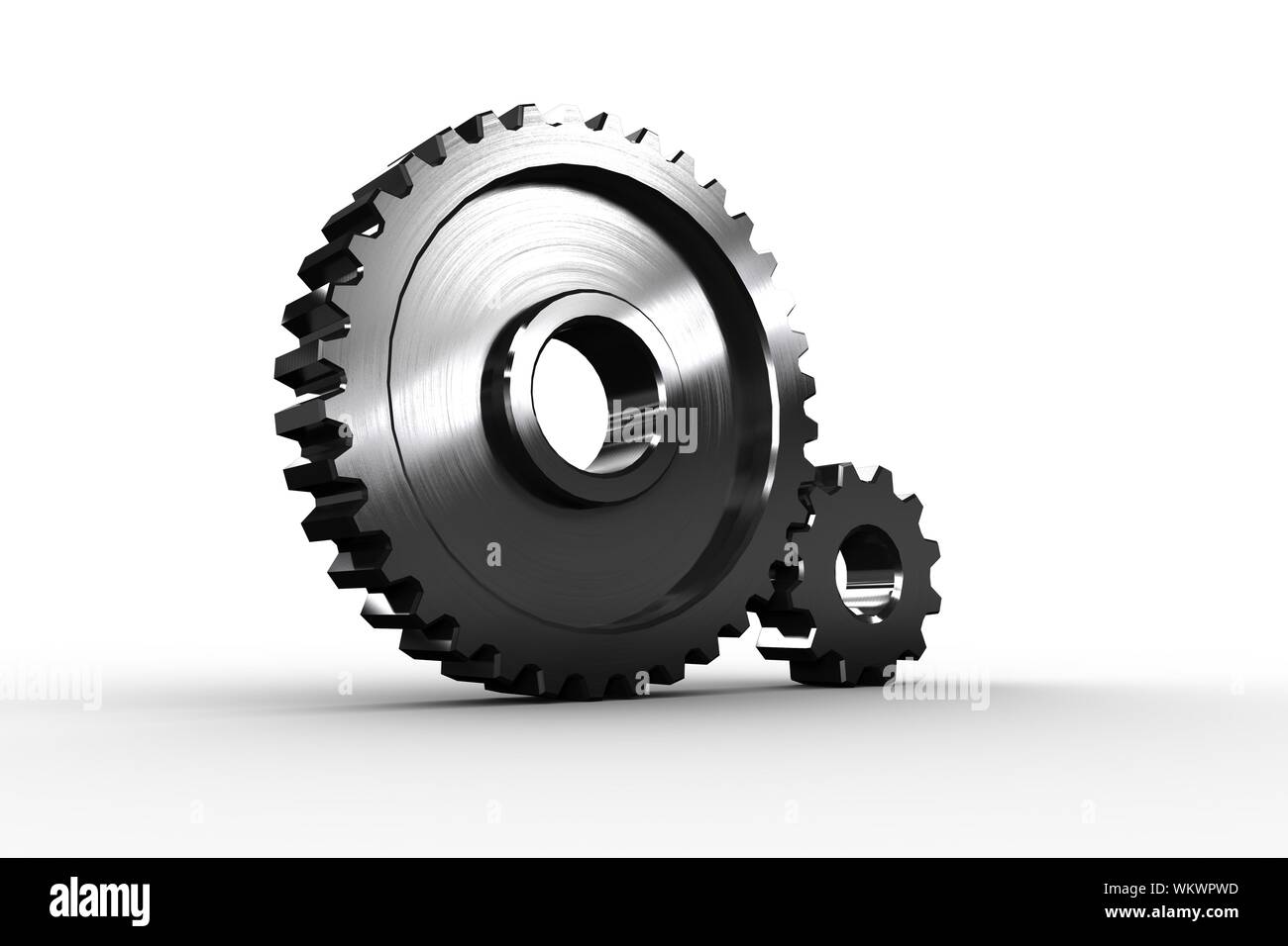 Metal cog and wheel connecting on white background Stock Photo - Alamy