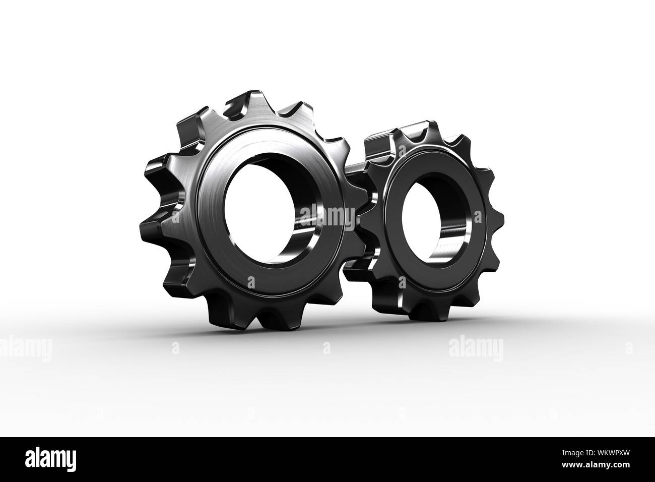 Metal cog and wheel connecting on white background Stock Photo - Alamy