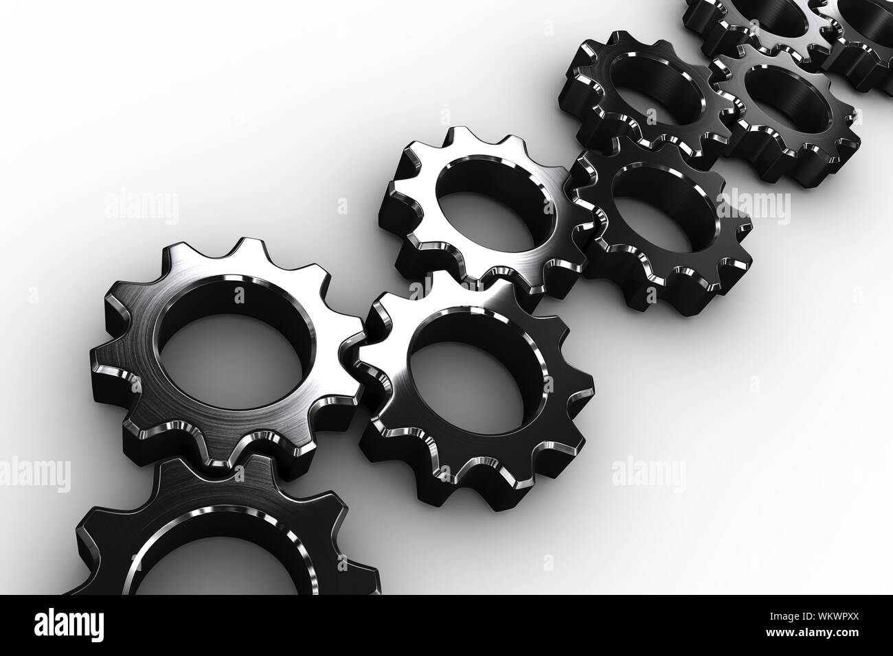 Metal cogs and wheels connecting on white background Stock Photo - Alamy