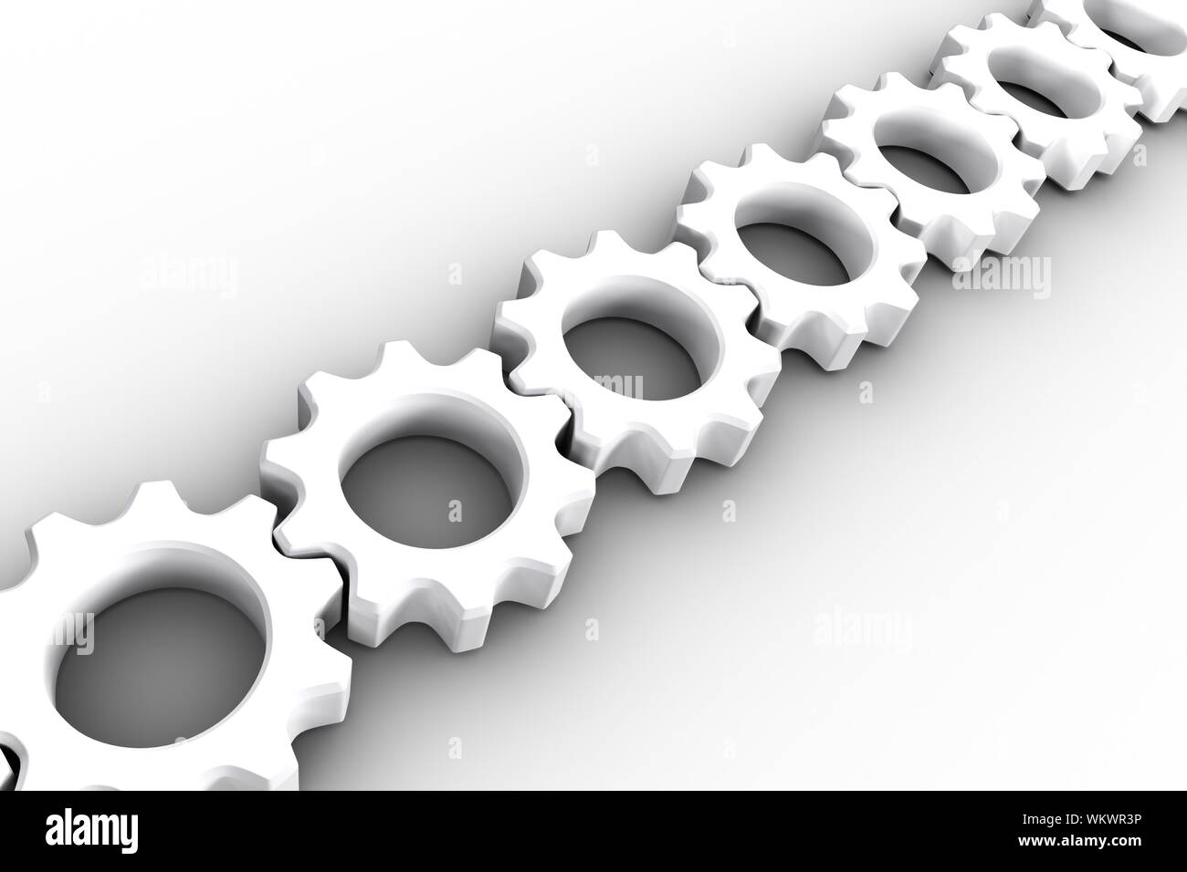 White cogs and wheels connecting on white background Stock Photo - Alamy