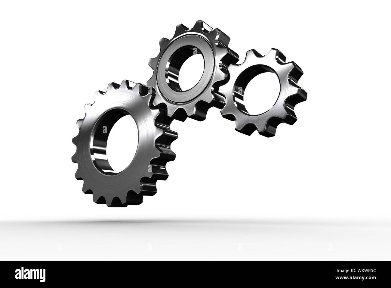 Metal cogs and wheels connecting on white background Stock Photo - Alamy