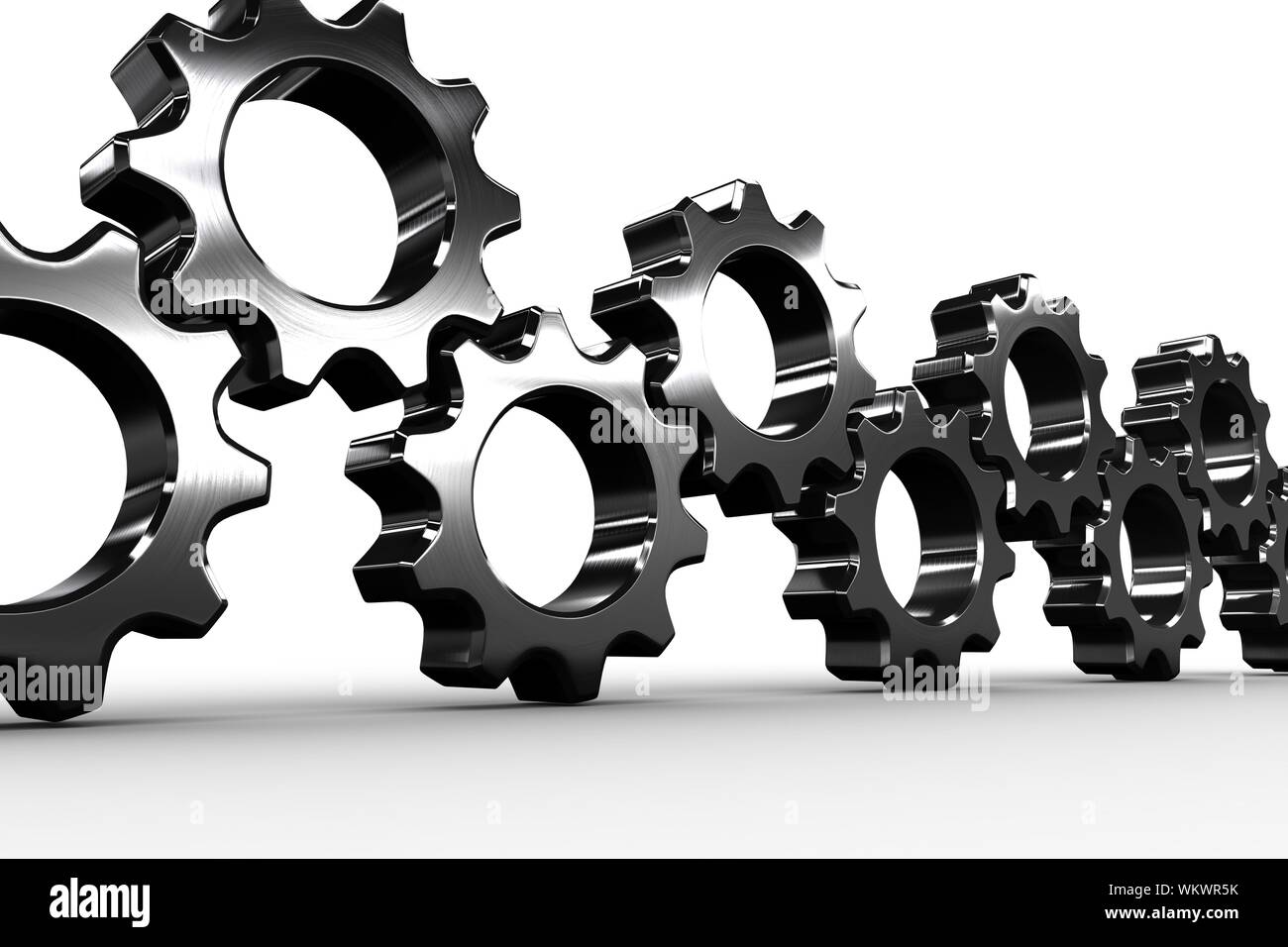 Metal cogs and wheels connecting on white background Stock Photo - Alamy
