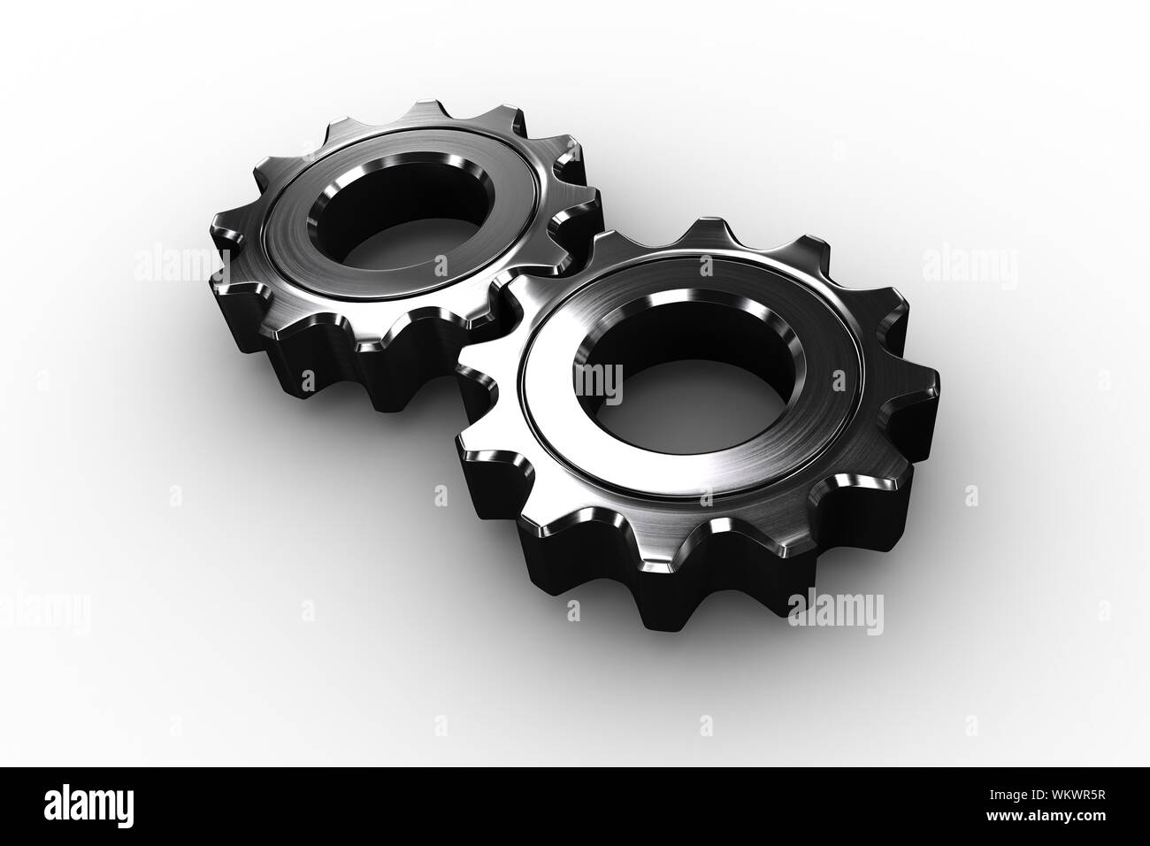Metal cog and wheel connecting on white background Stock Photo - Alamy