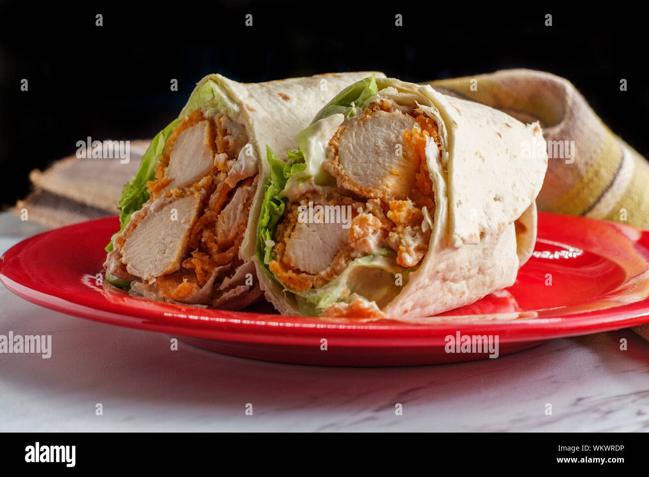 Crispy chicken Caesar salad wrap sandwich with romaine lettuce Stock ...