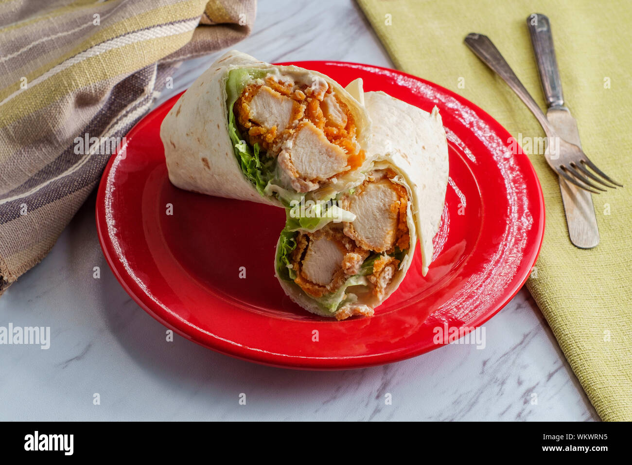 Crispy chicken Caesar salad wrap sandwich with romaine lettuce Stock ...