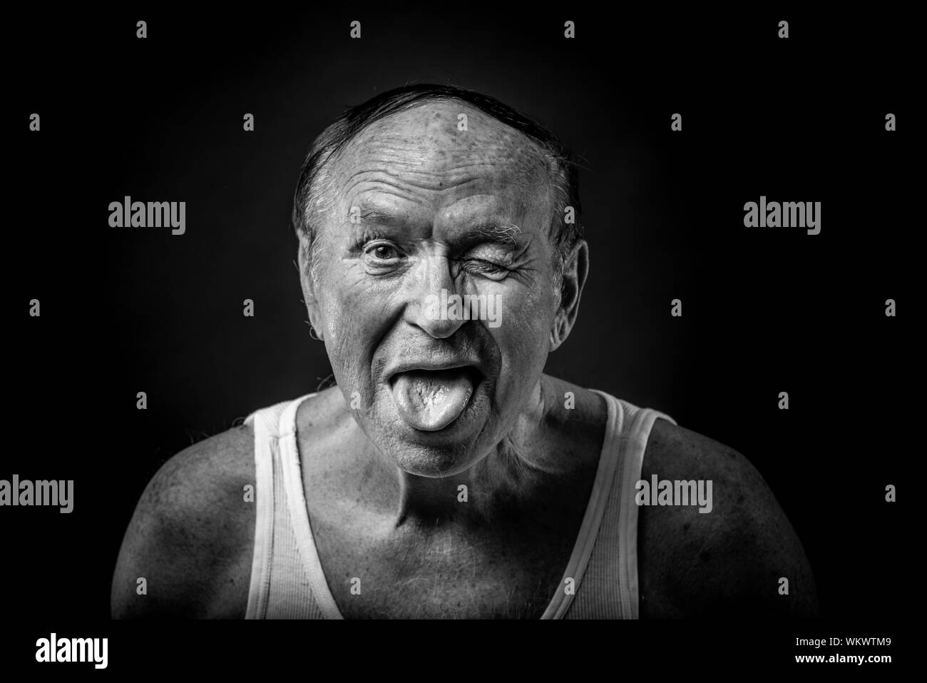 Face old man sticking tongue hi-res stock photography and images - Alamy