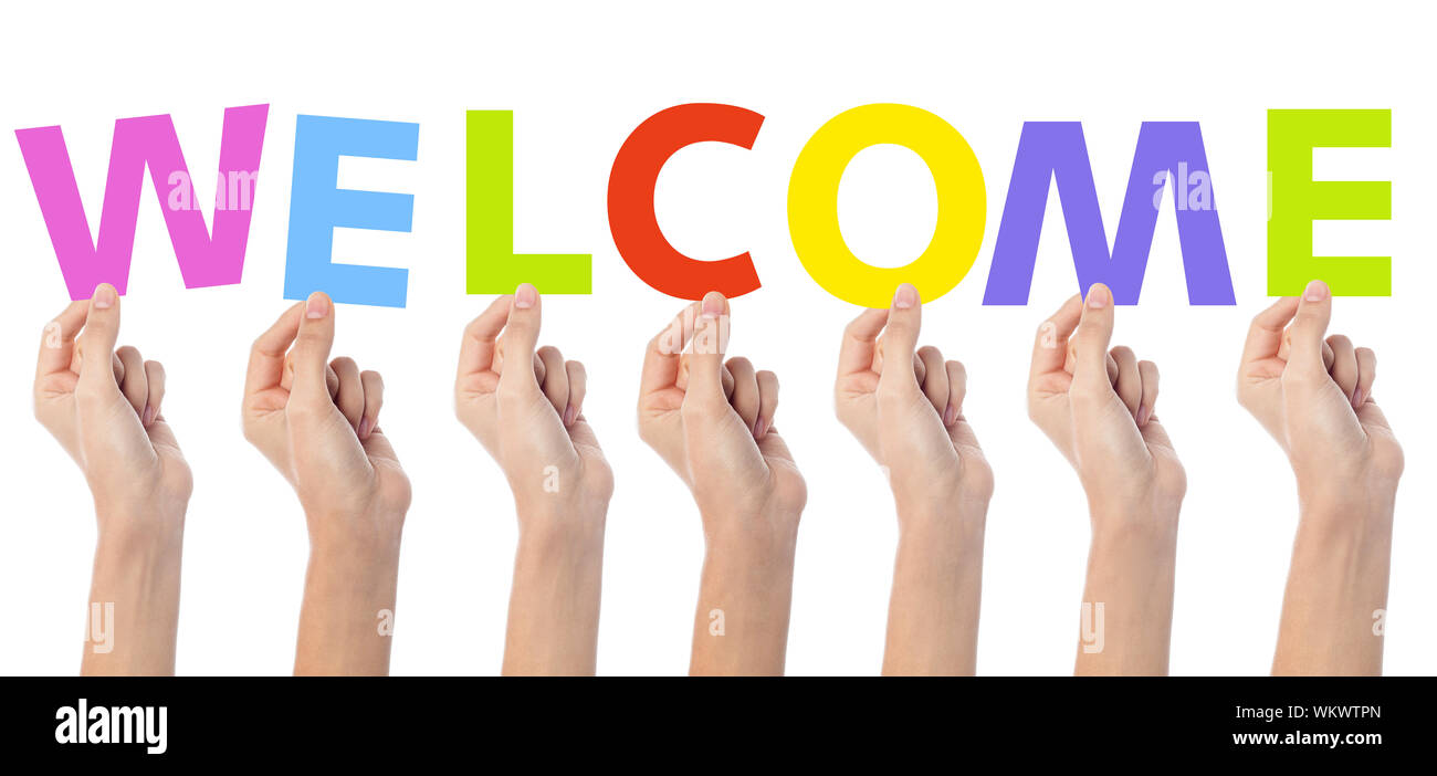 Diverse hands holding colorful words welcome Stock Photo - Alamy