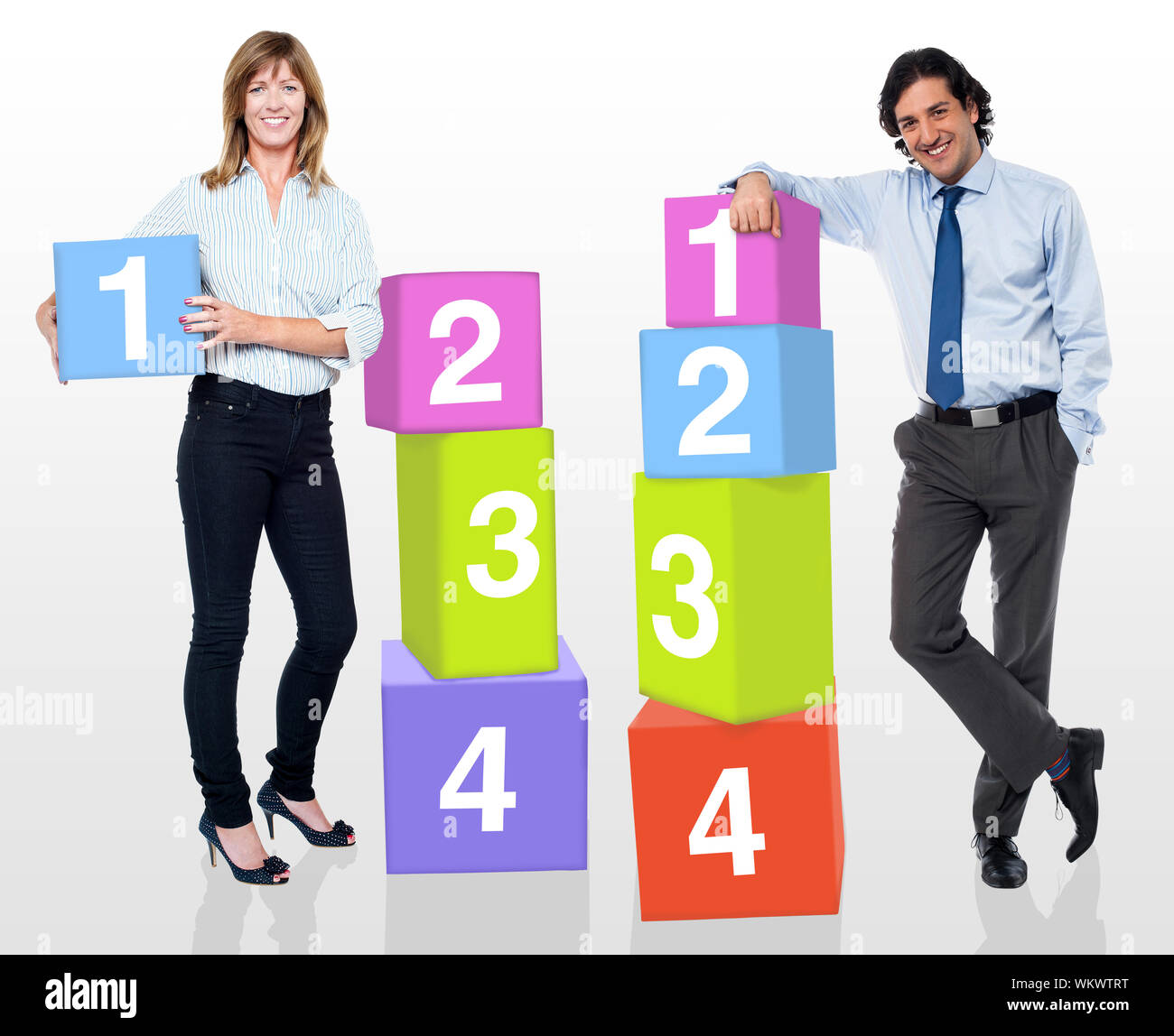 Corporates posing beside colorful number blocks Stock Photo - Alamy