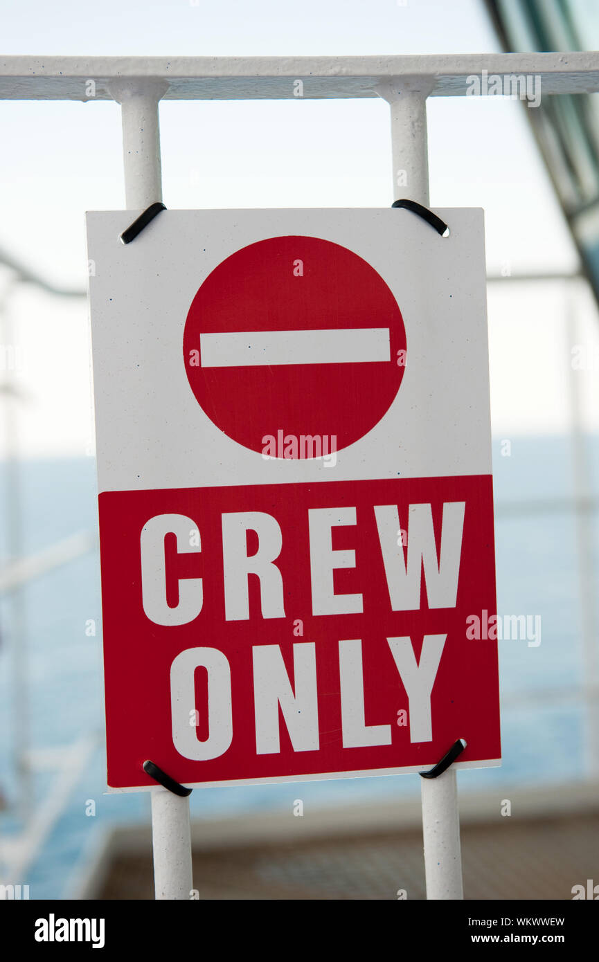 a sign board with crew only on a ship at the sea Stock Photo - Alamy