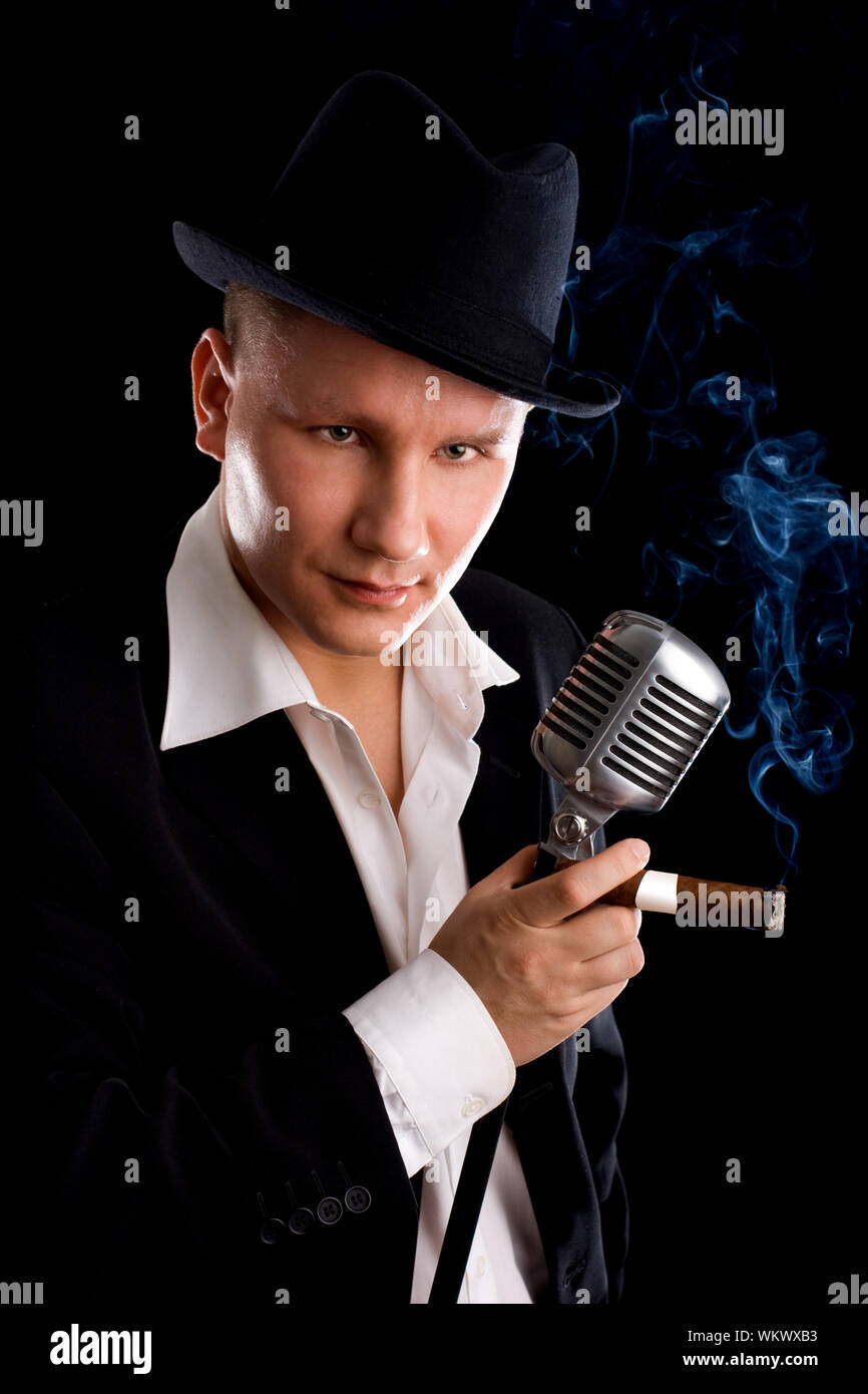 Jazzman and retro microphone in suit and hat Stock Photo - Alamy