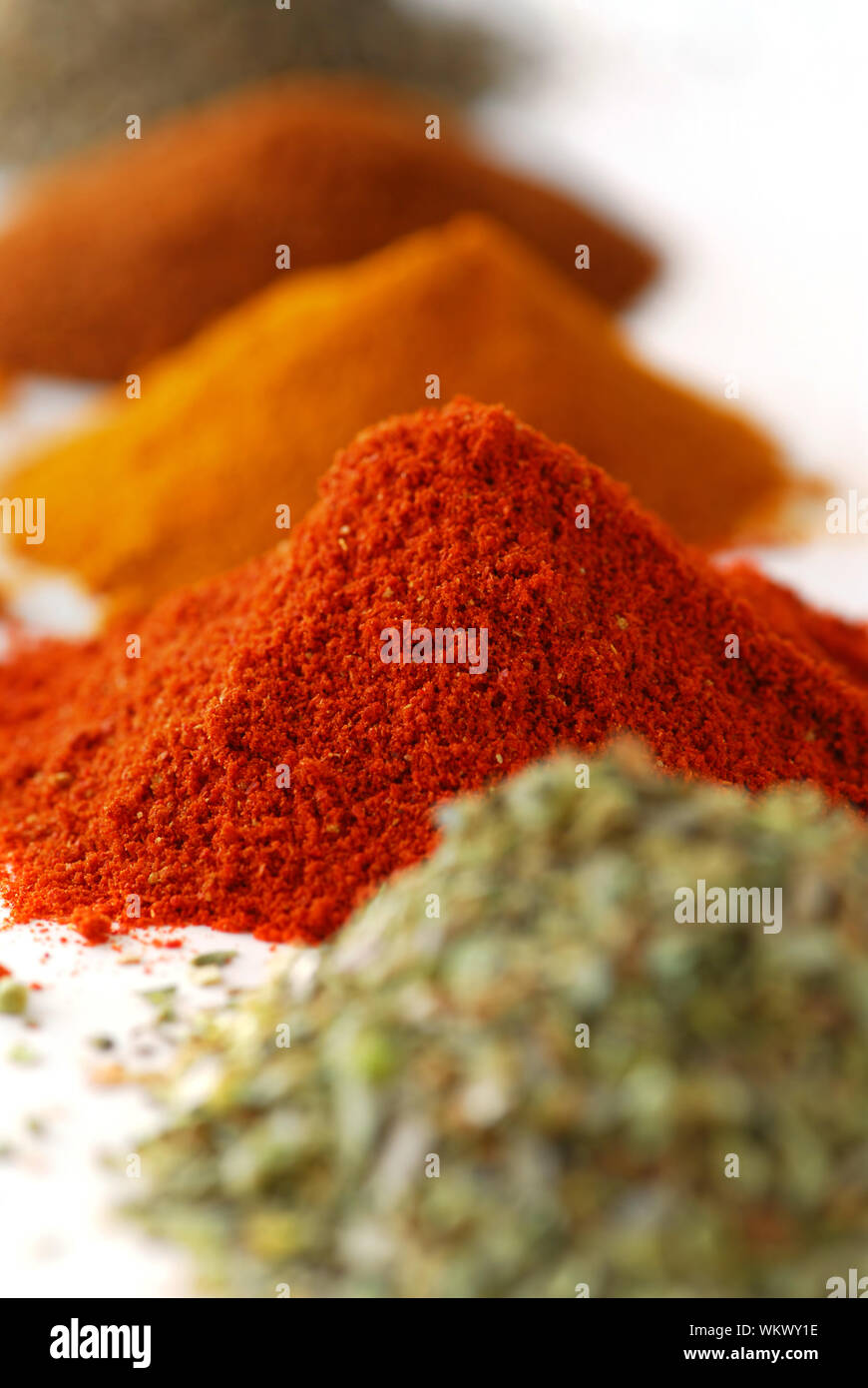 Heaps of various ground spices on white background Stock Photo - Alamy