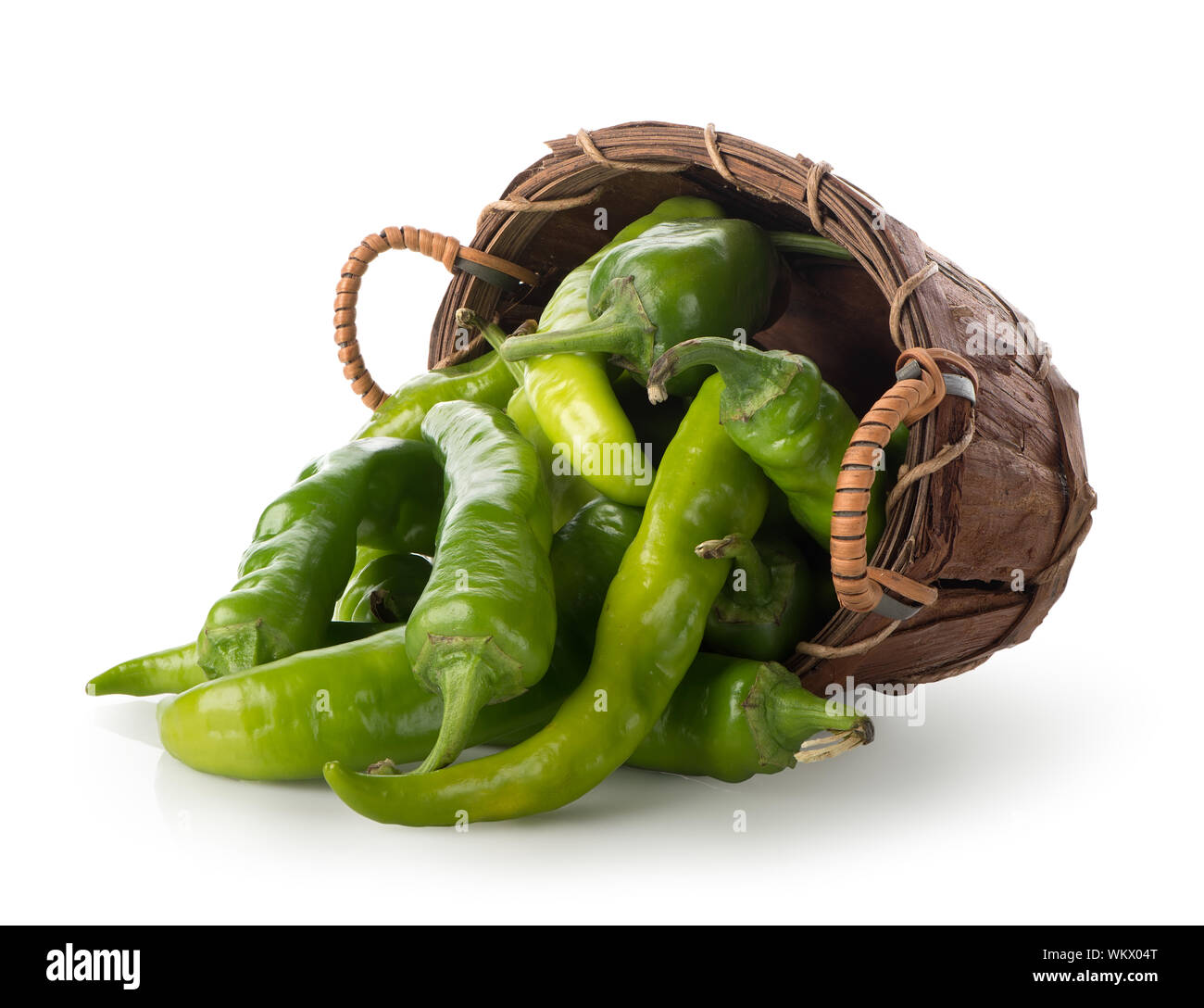 Pepper in a basket isolated on white Stock Photo - Alamy