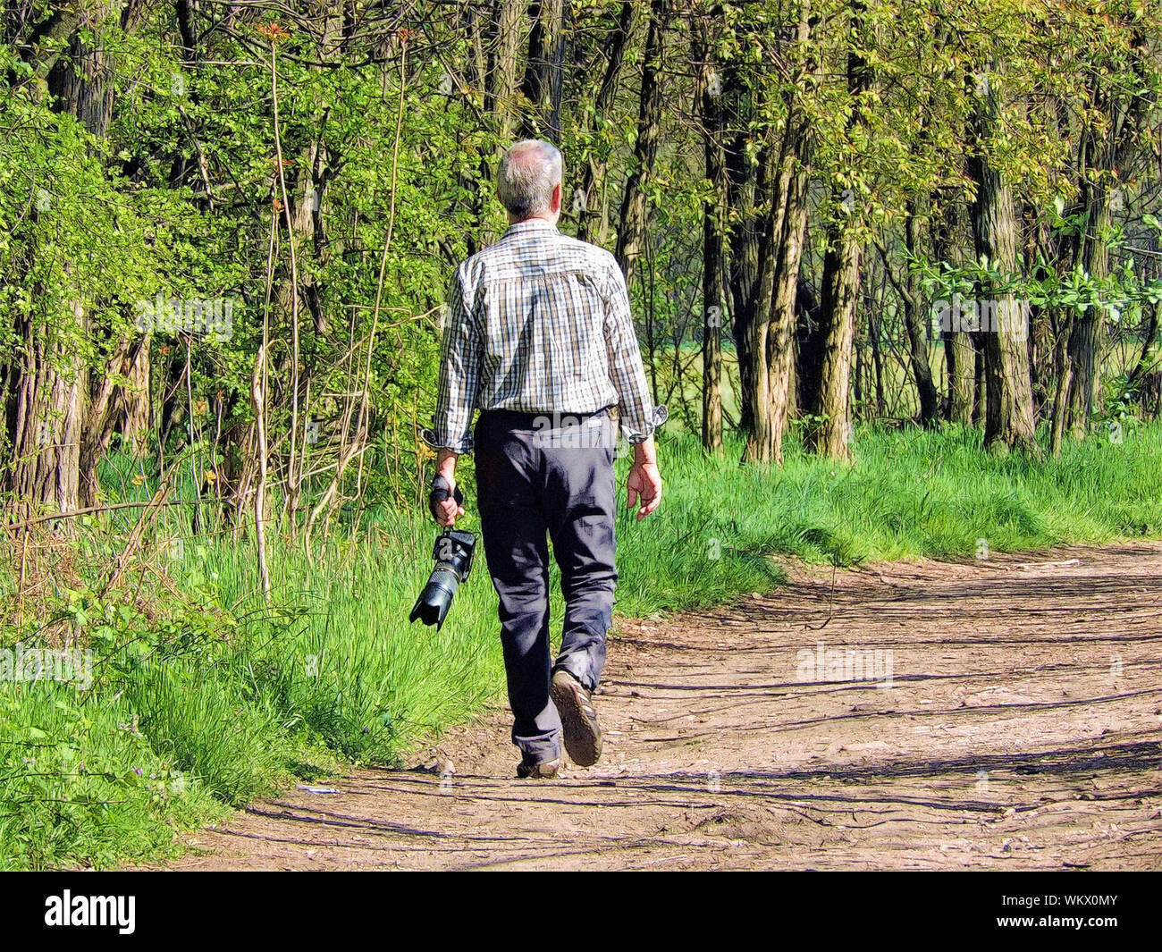 Man walking with camera hi-res stock photography and images - Alamy