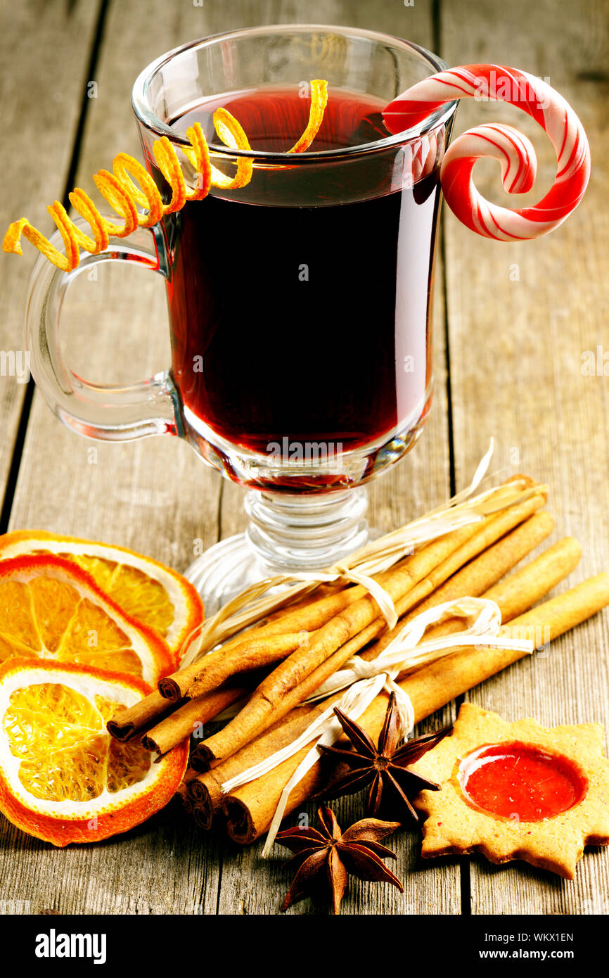 Glass of red mulled wine on wooden table Stock Photo - Alamy